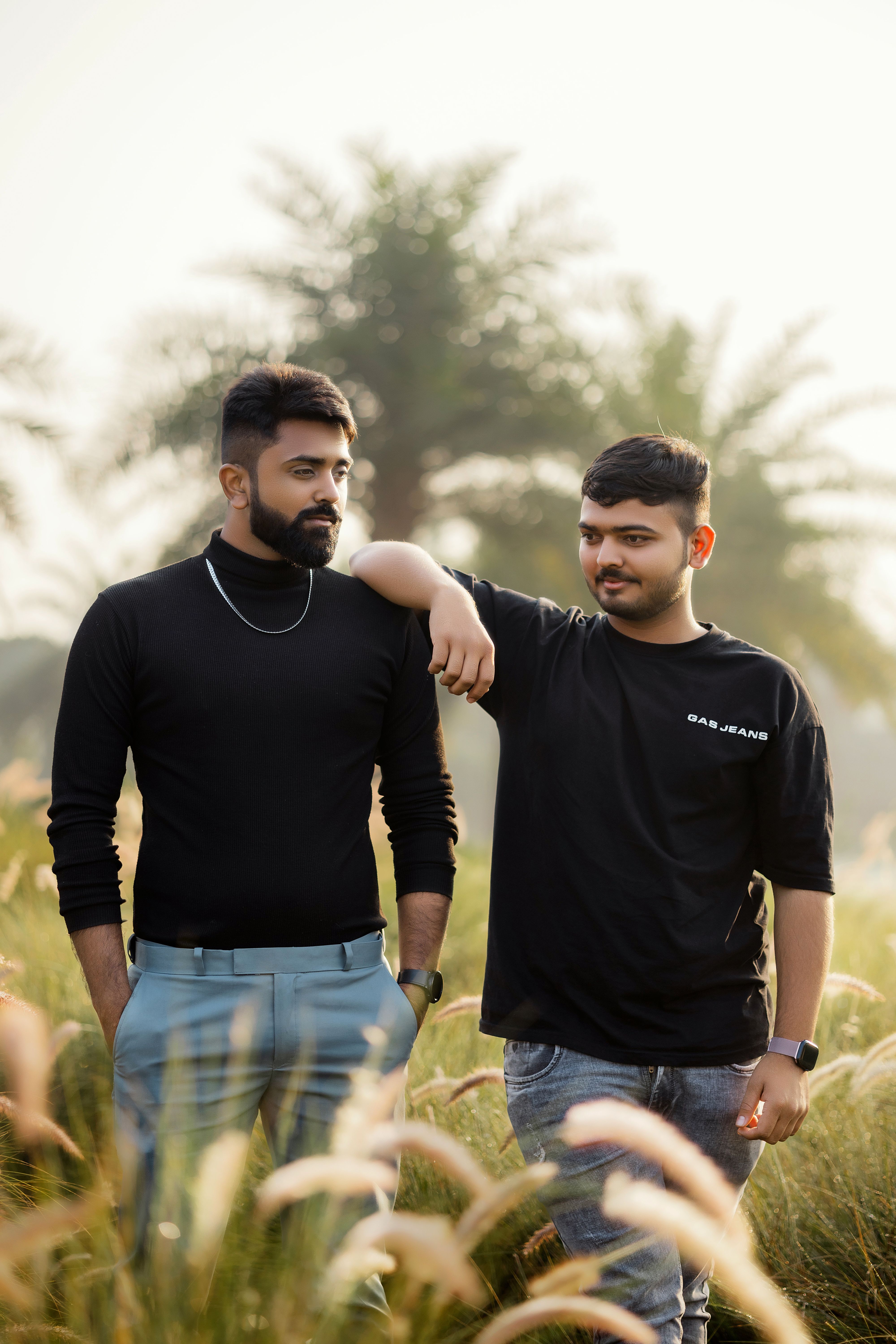 Two Friends Relaxing Outdoors in Summer Fields · Free Stock Photo