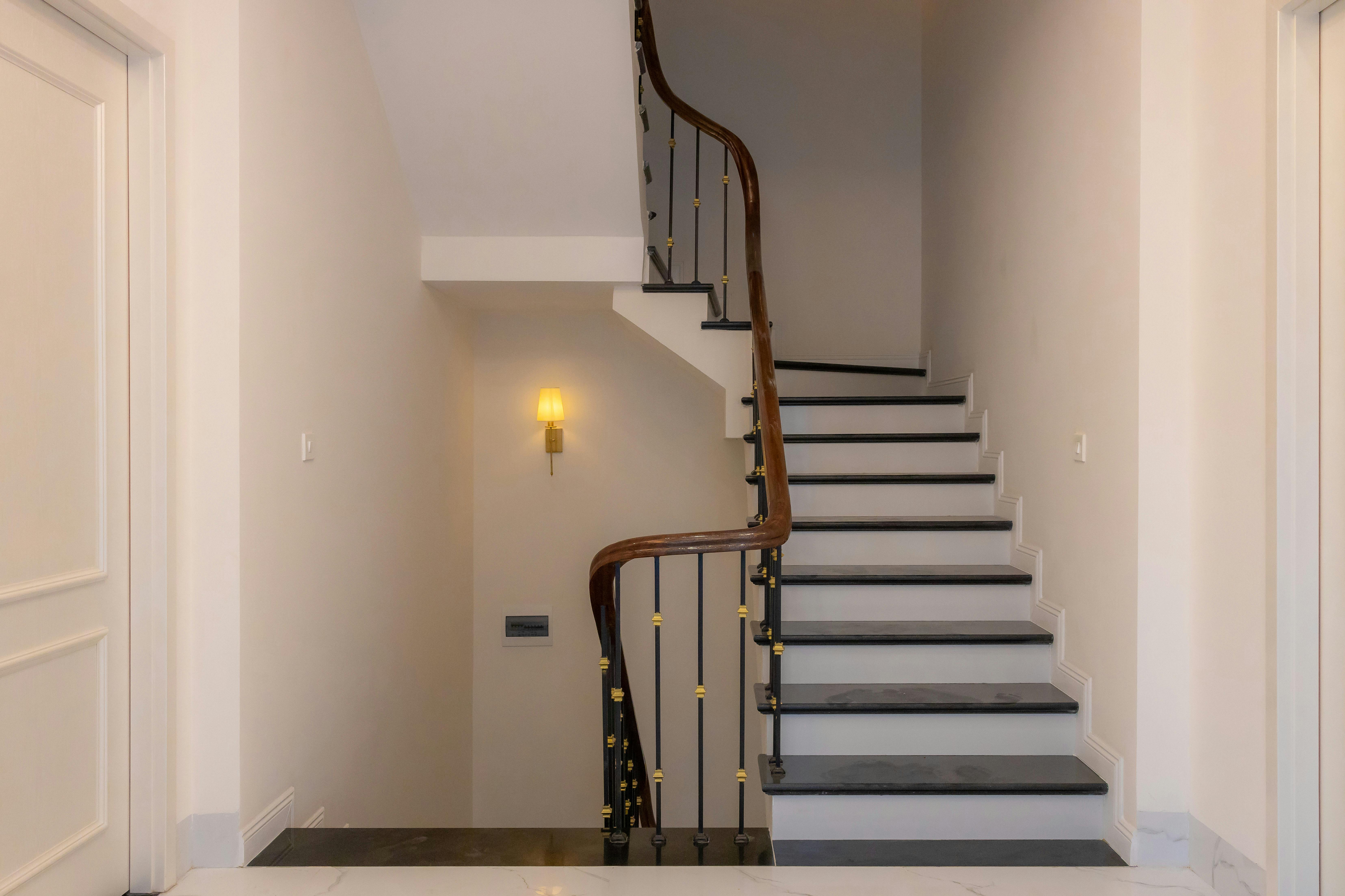 Elegant Staircase with Wooden Handrail in Modern Home · Free Stock Photo