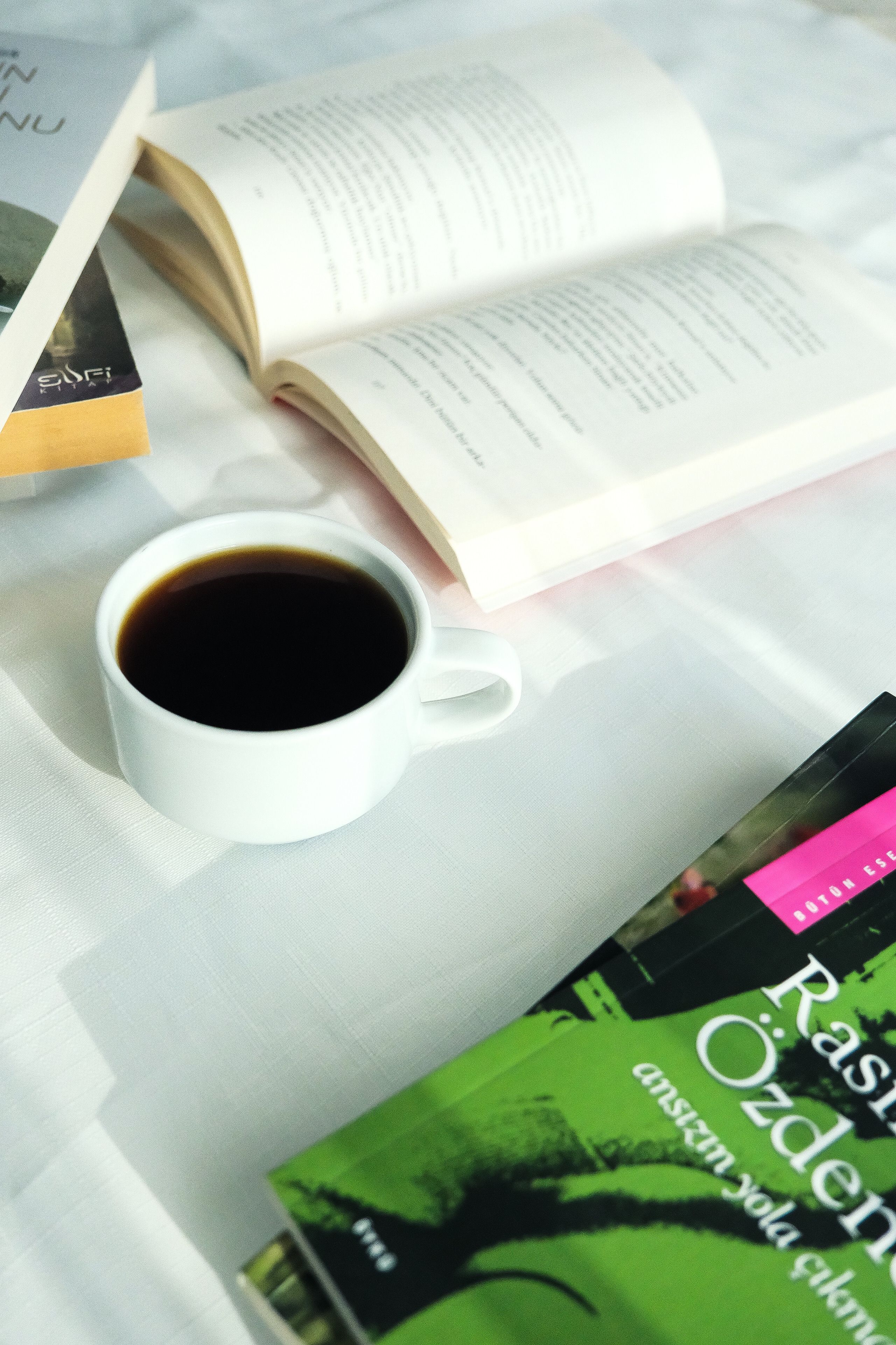 Cozy Reading Scene with Coffee and Books · Free Stock Photo