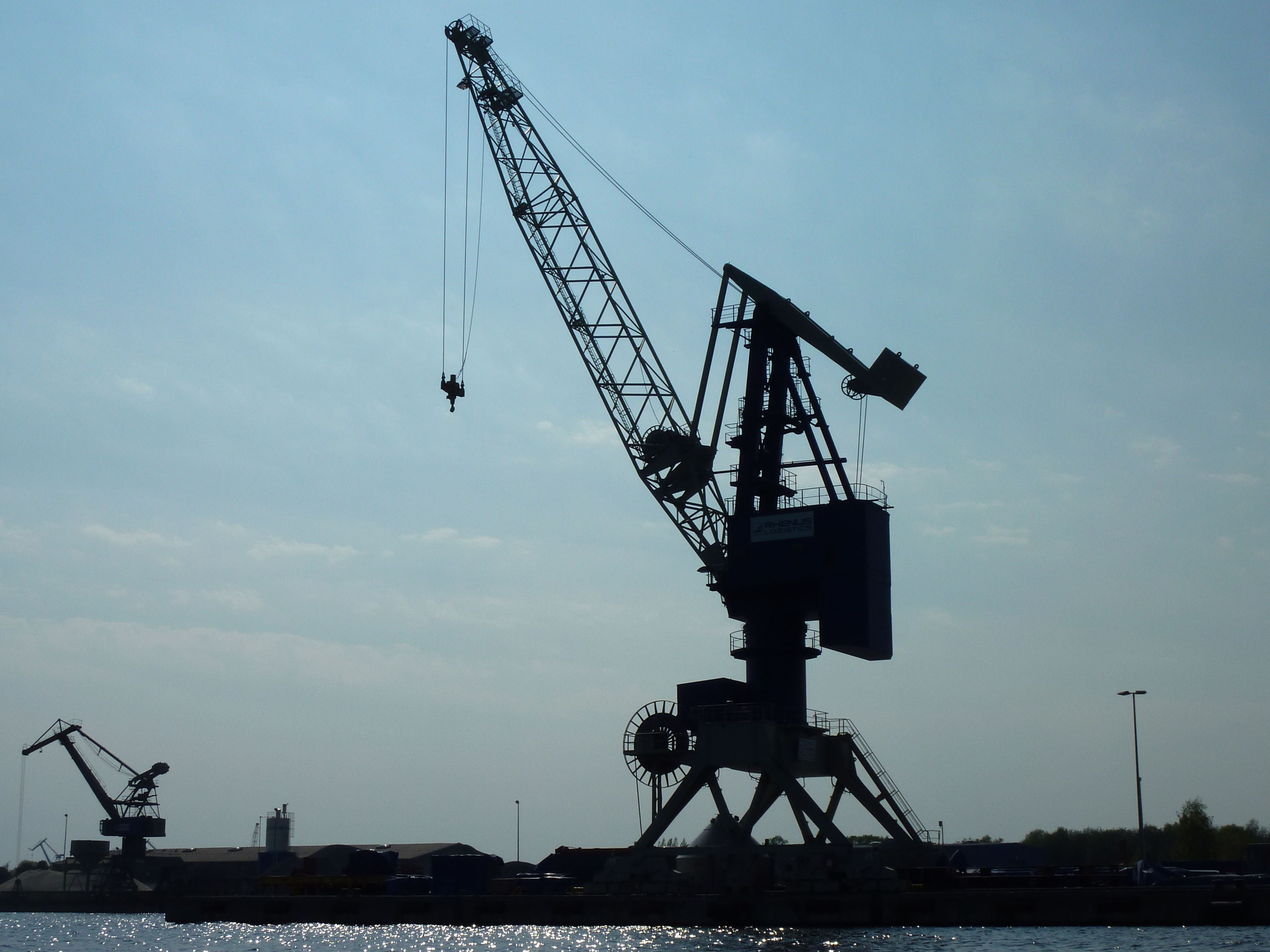 Industrial Excavators Loading Coal at a Port · Free Stock Photo