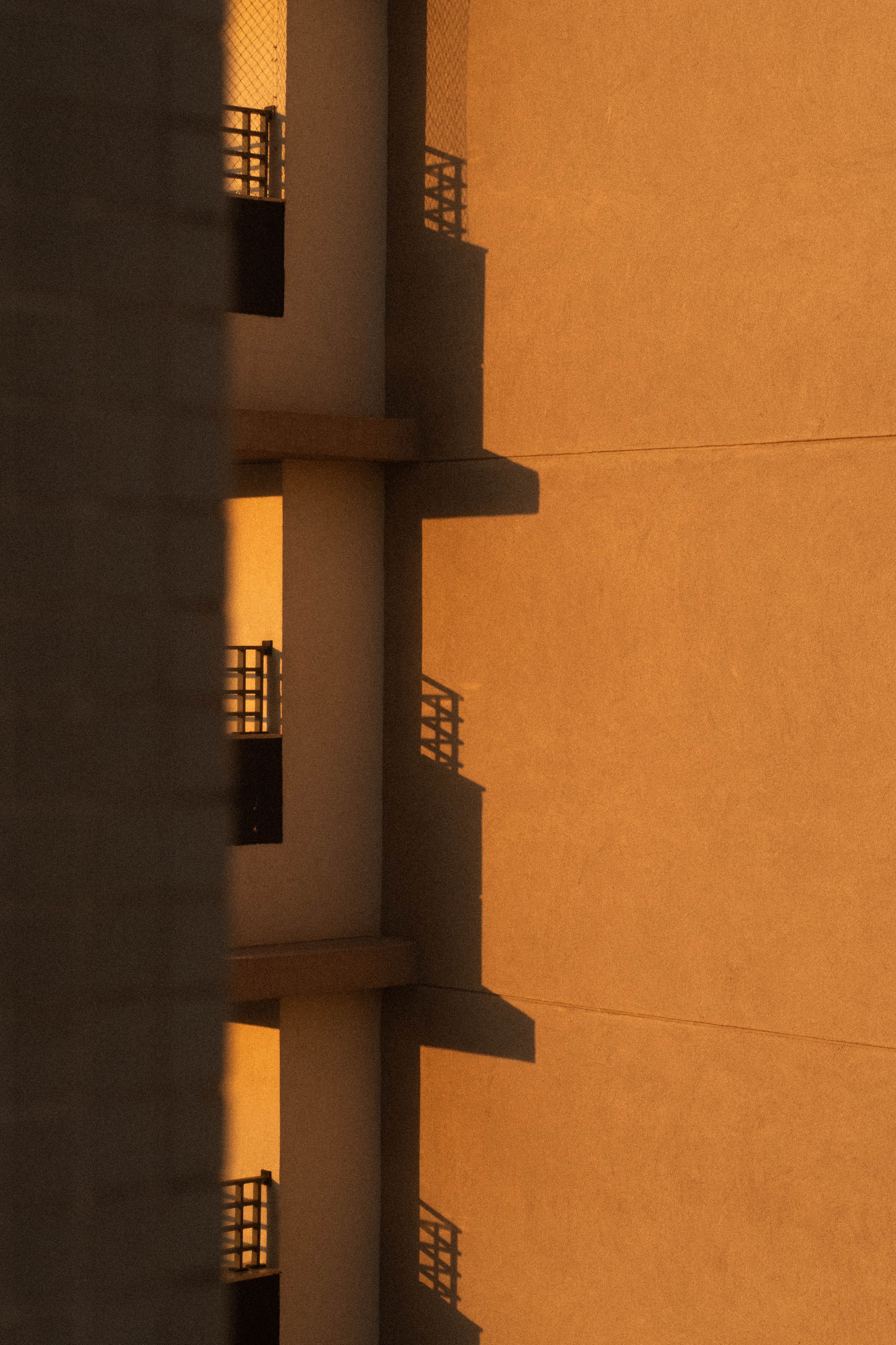 Abstract Shadows on Building Facade at Sunset · Free Stock Photo