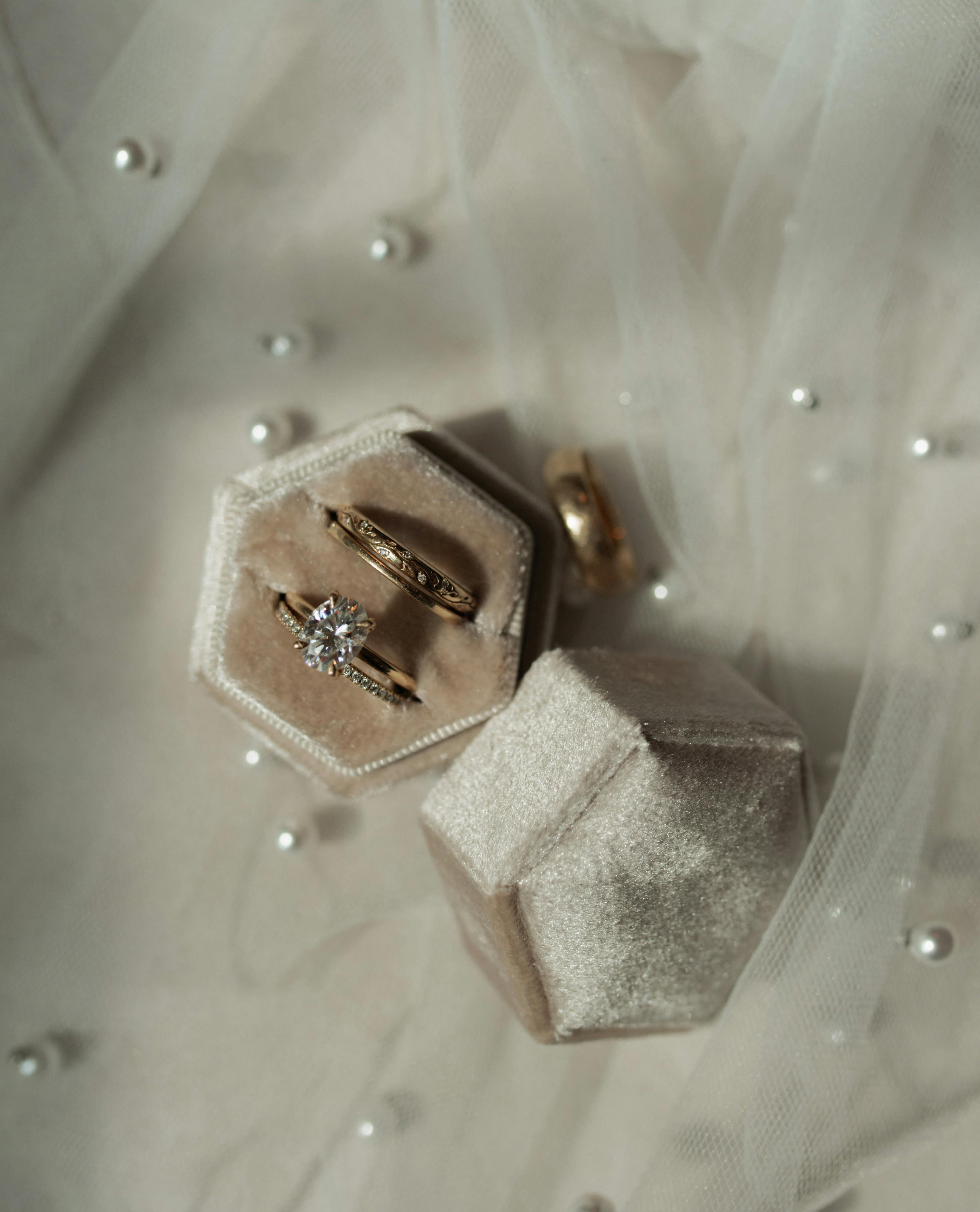 Elegant Engagement and Wedding Rings on Velvet · Free Stock Photo