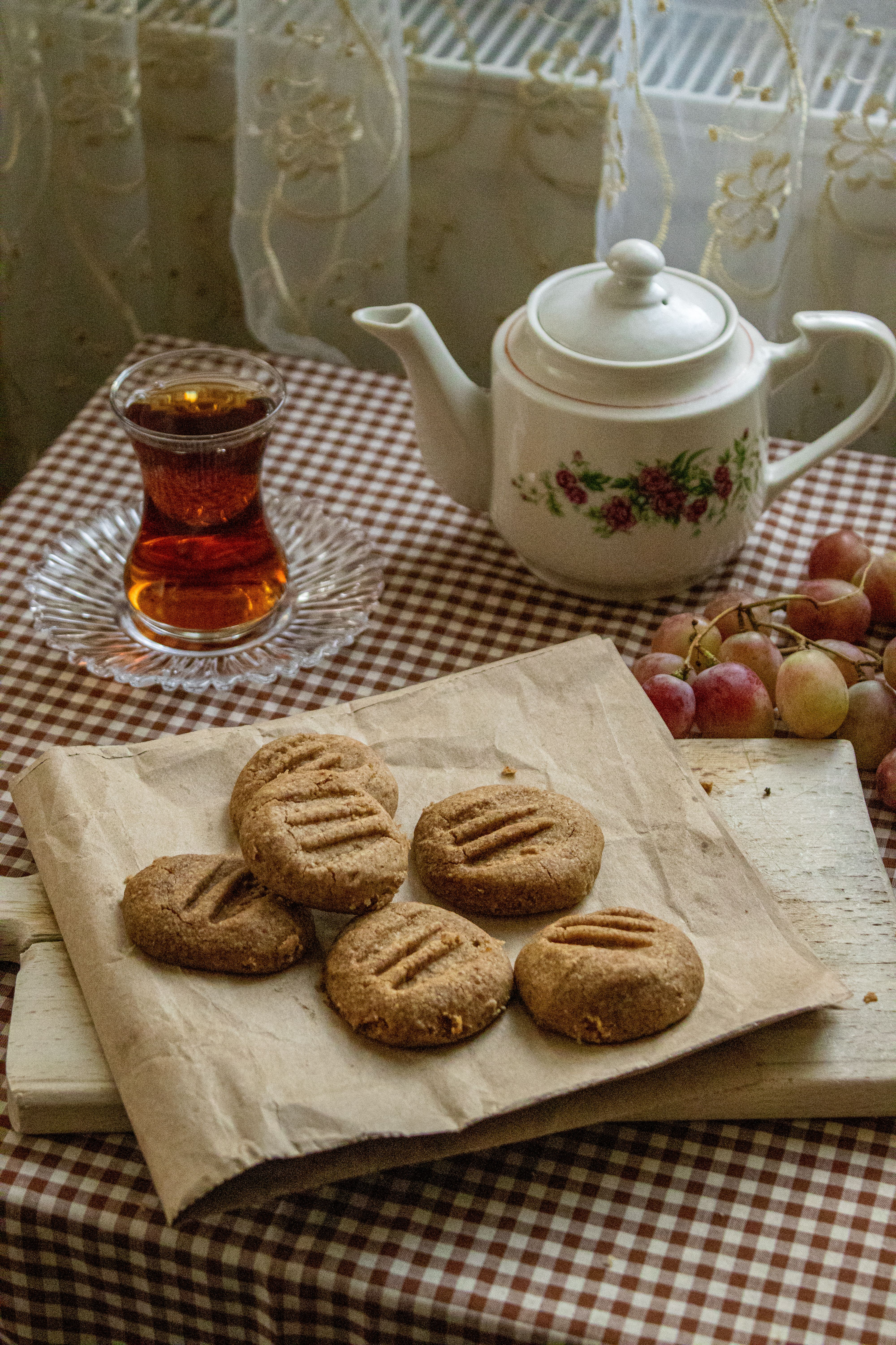Cozy Afternoon Tea with Cookies and Grapes · Free Stock Photo