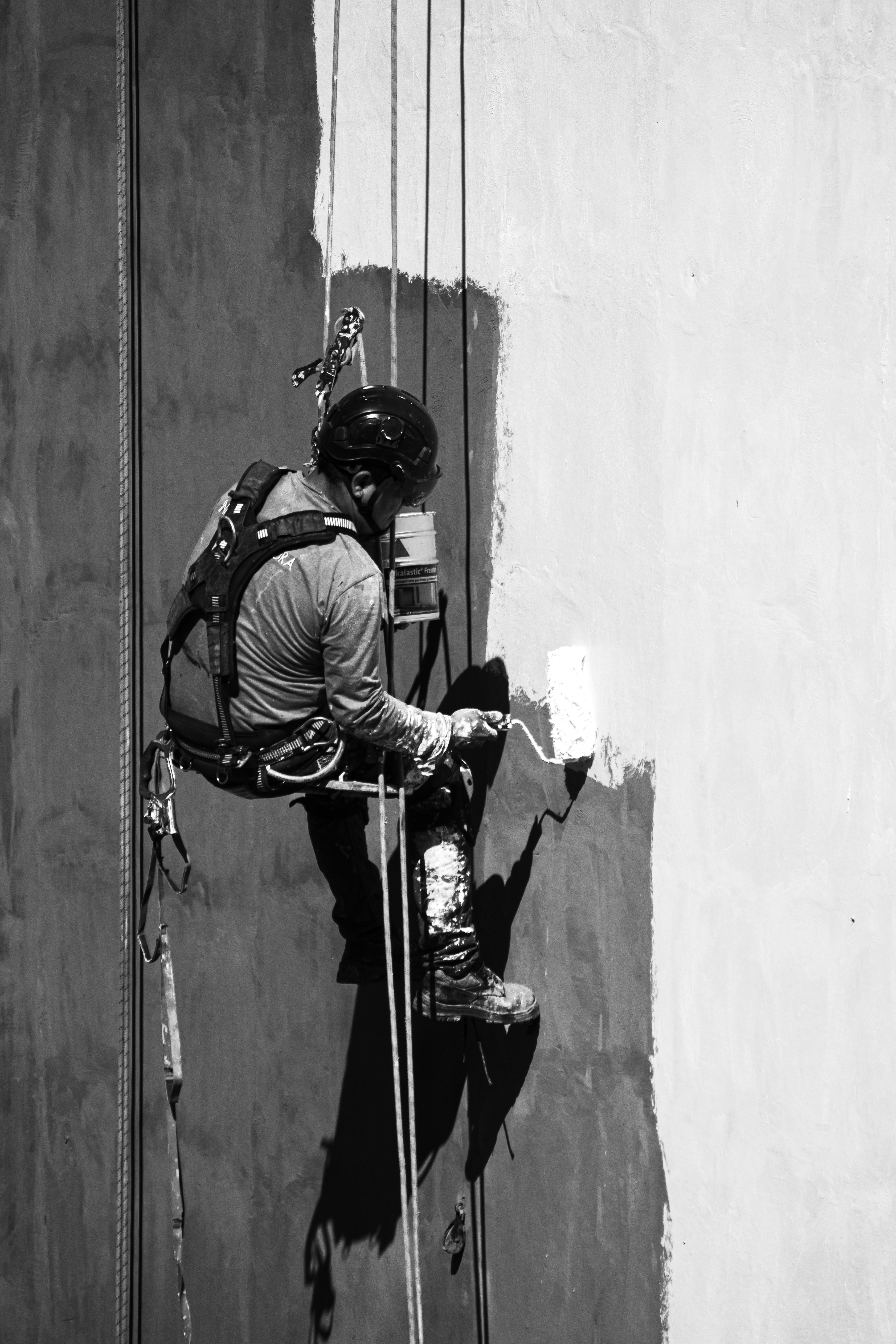 Worker Painting High Building Facade in Buenos Aires · Free Stock Photo