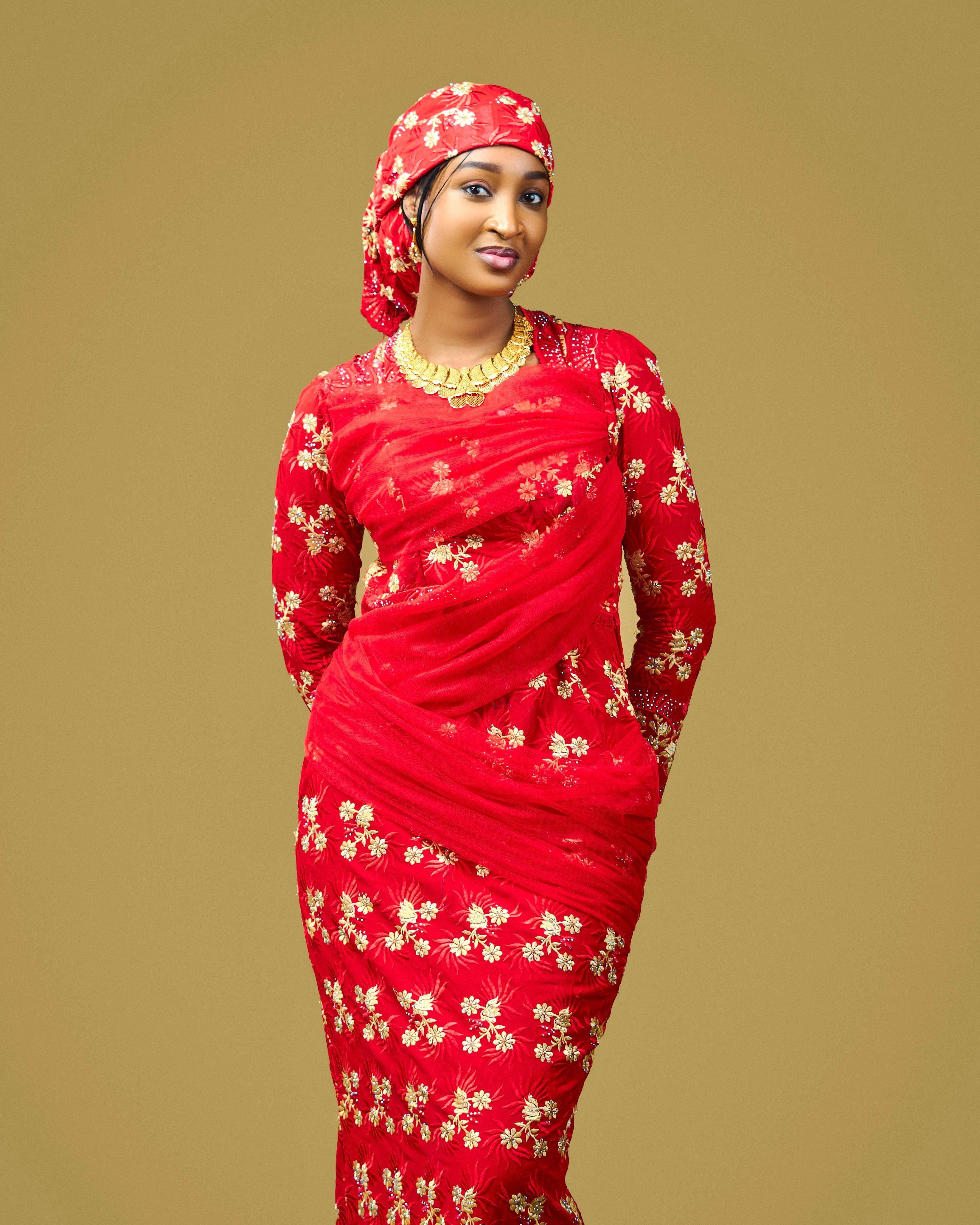 Elegant Woman in Traditional Red Dress on Neutral Background · Free ...