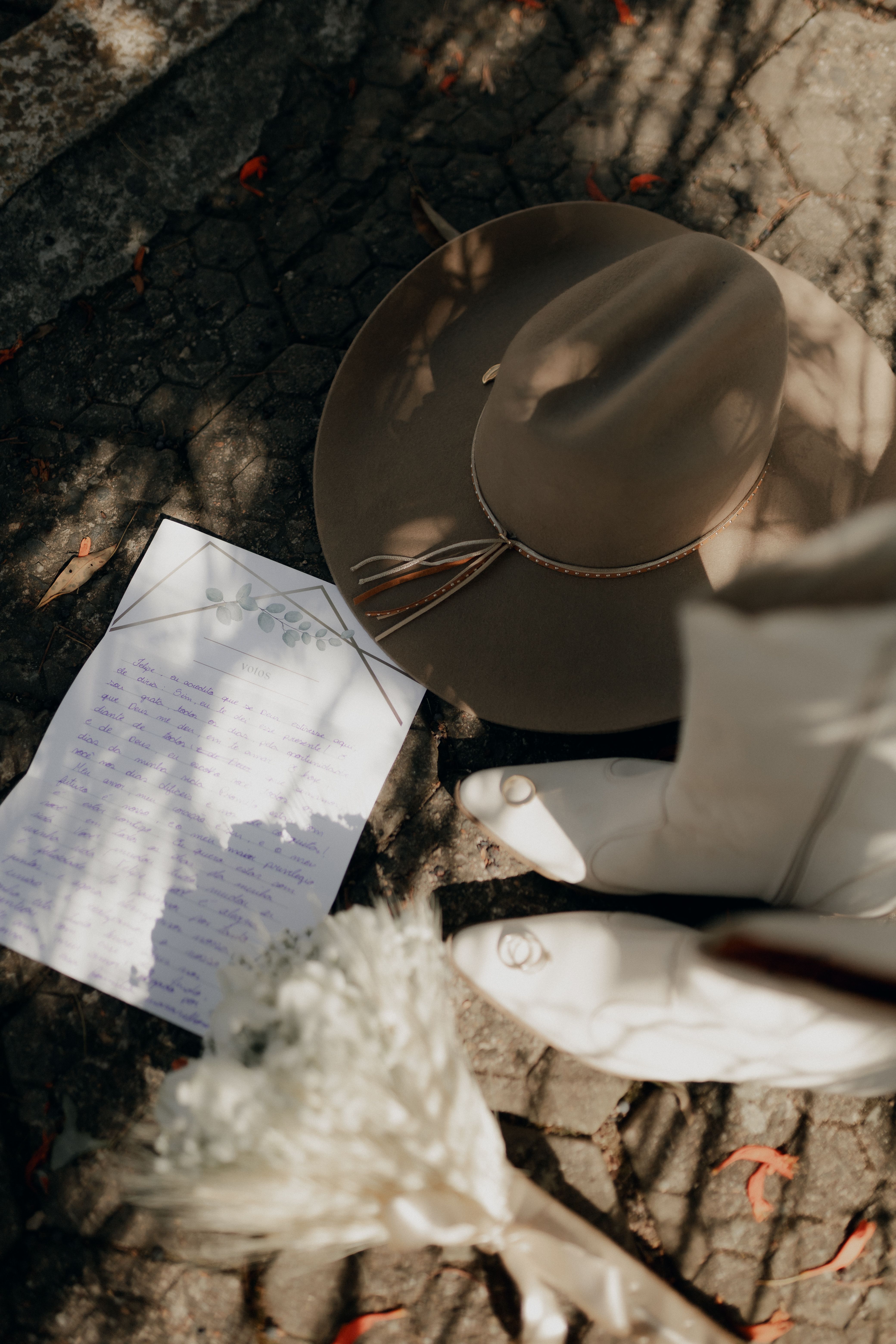 Rustic Flat Lay with Cowboy Hat and Boots Outdoors · Free Stock Photo