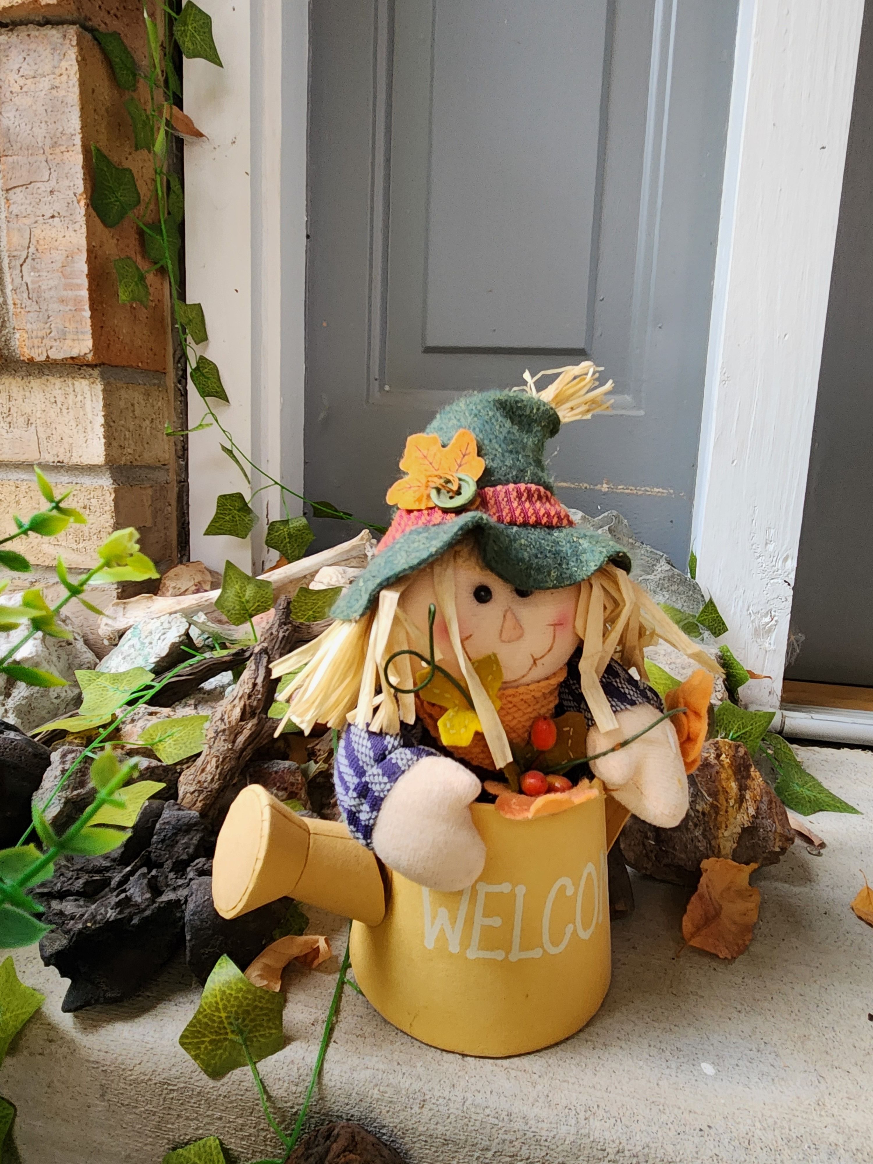 Welcoming Autumn Scarecrow Decoration in Porch · Free Stock Photo