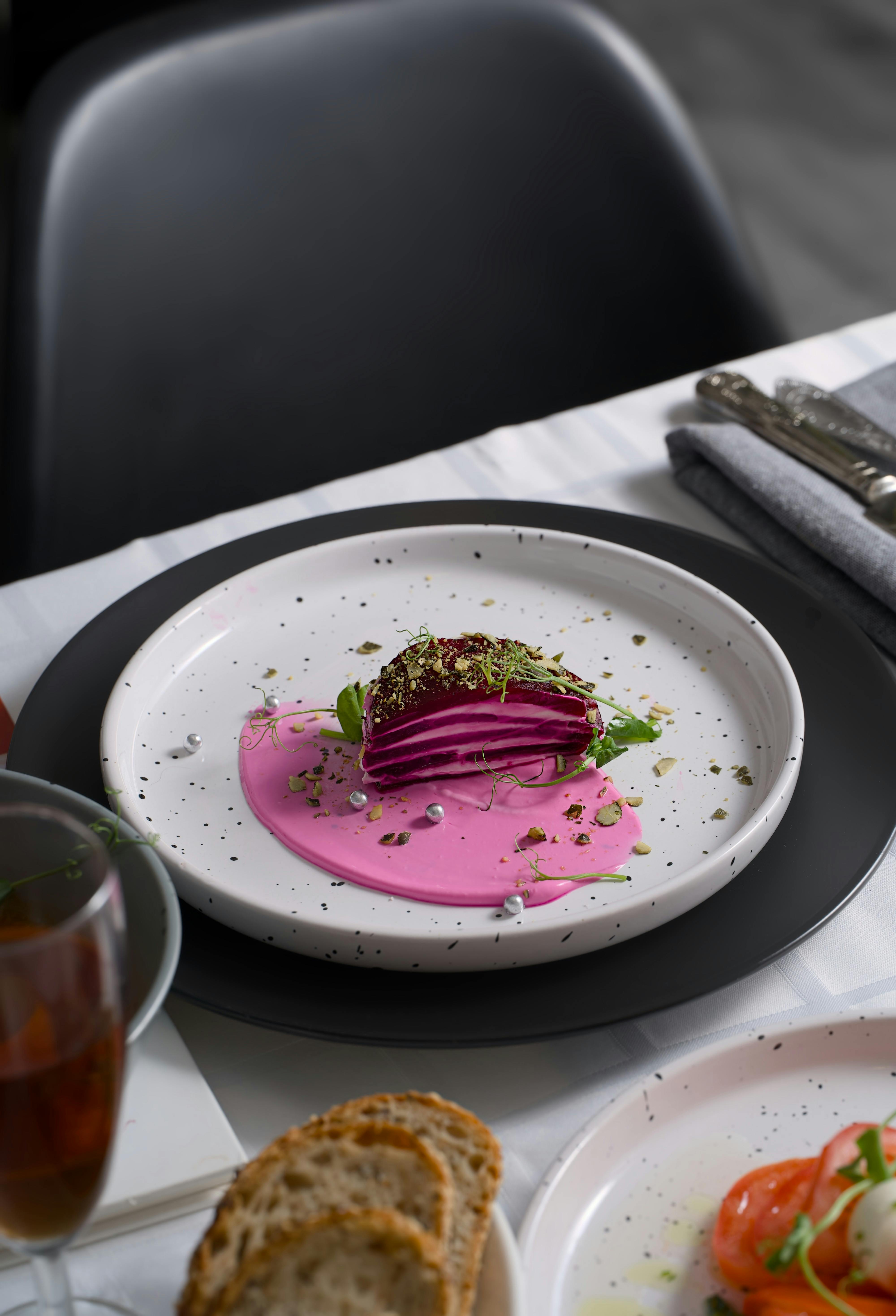 Elegant Beet Dish with Pink Sauce on White Plate · Free Stock Photo
