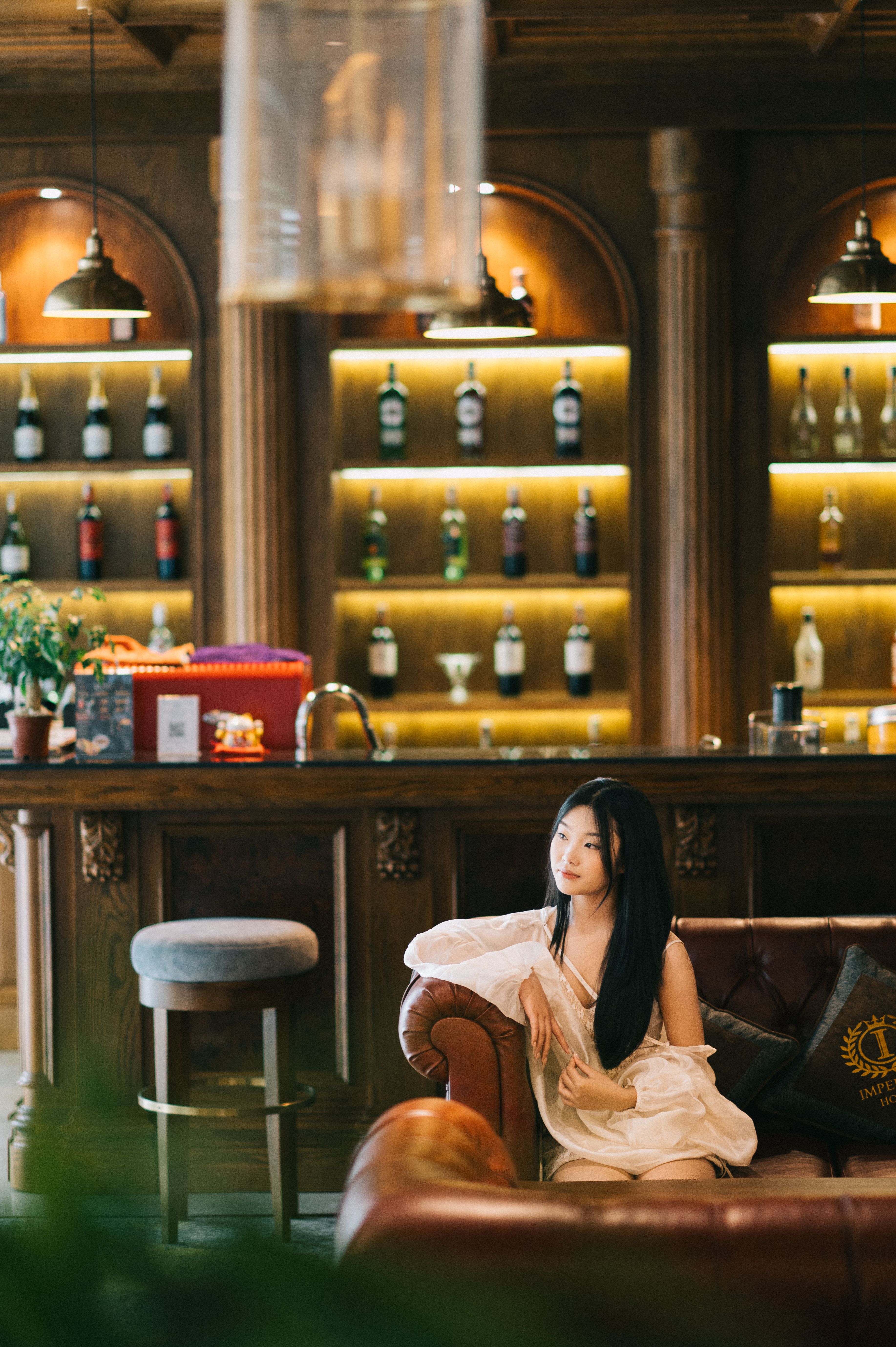 Elegant Woman Relaxing in Vietnamese Hotel Lounge · Free Stock Photo