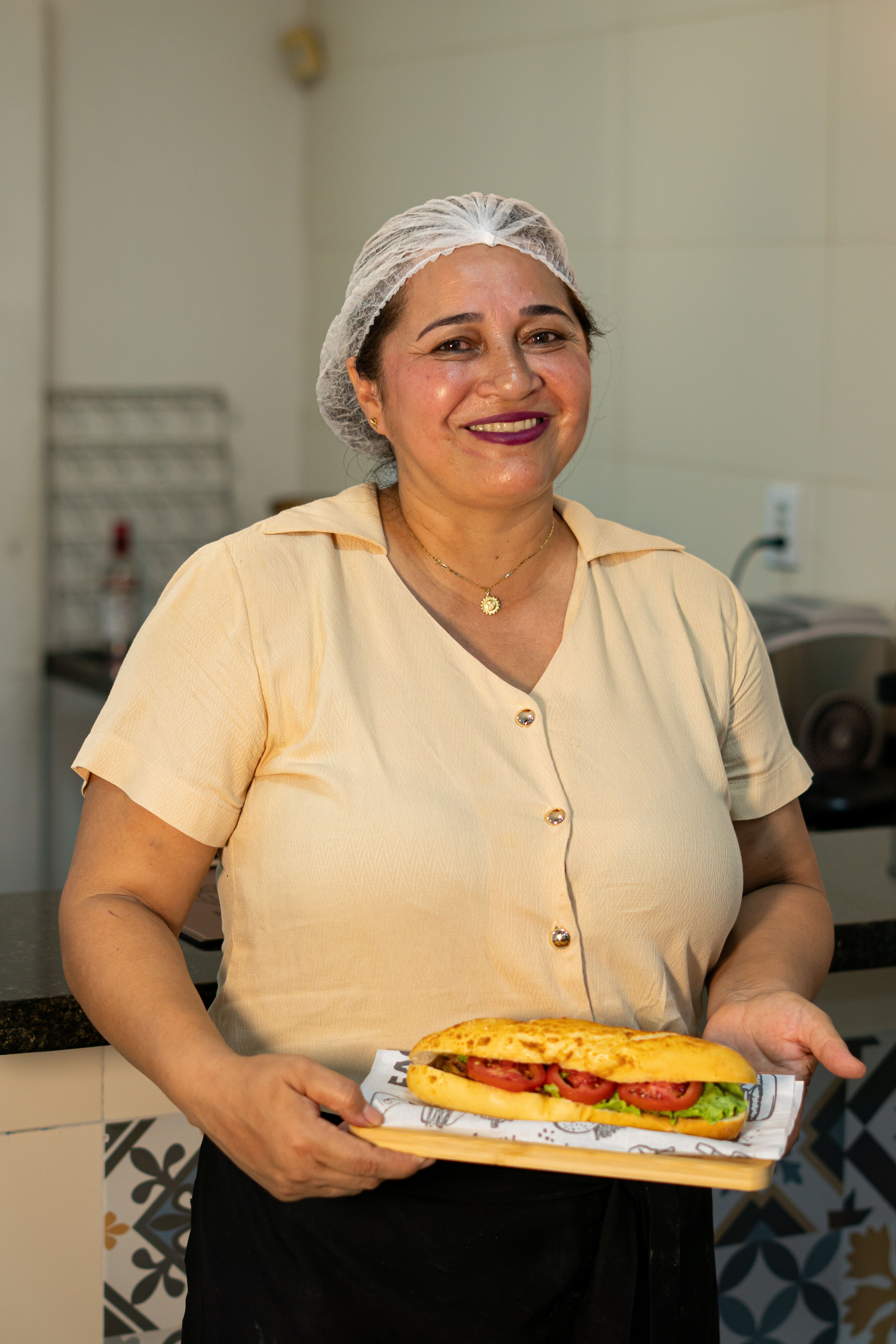 Smiling Chef Presenting Fresh Sandwich · Free Stock Photo