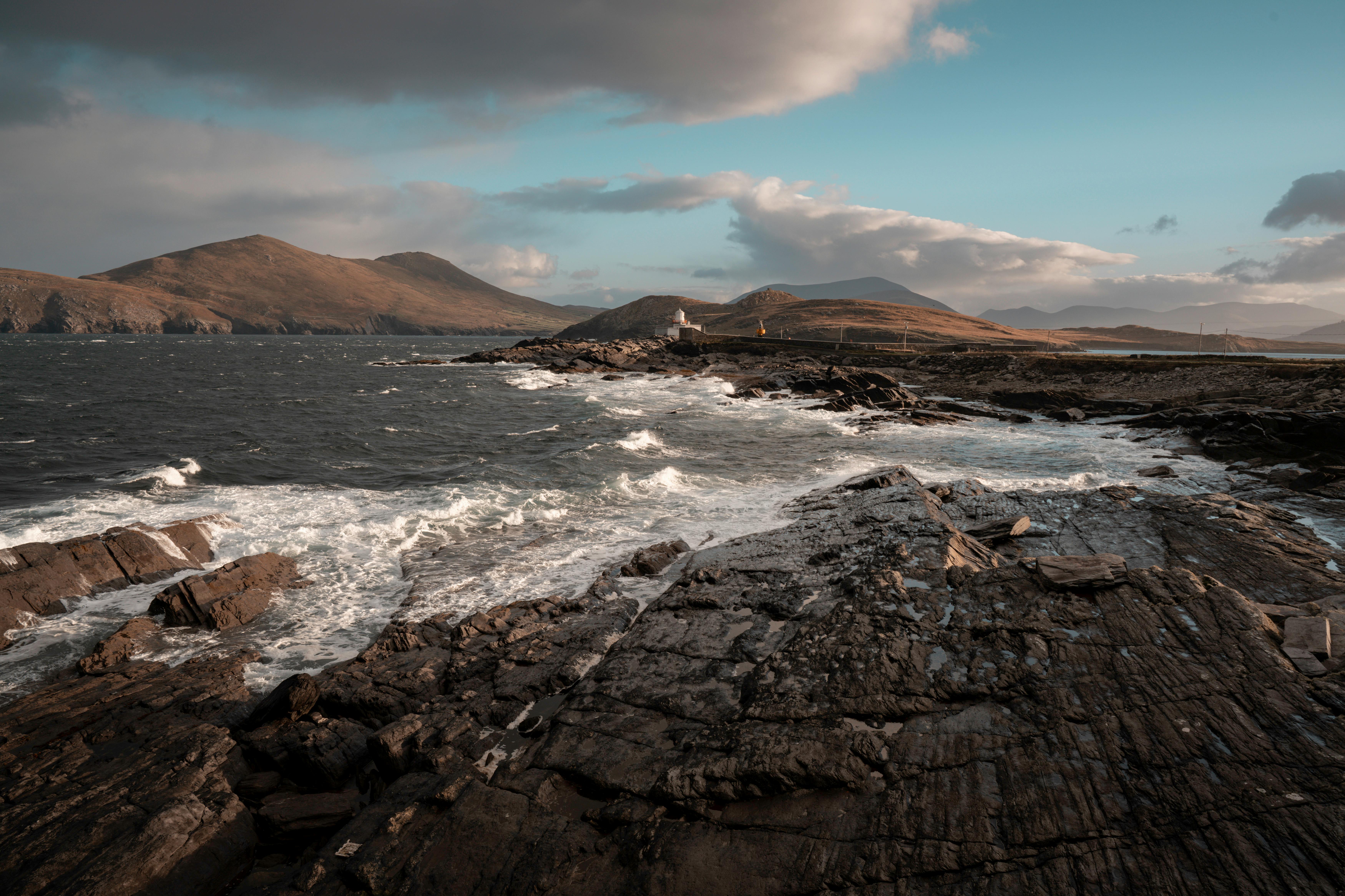 Scenic View of Kerry Coastline with Lighthouse · Free Stock Photo