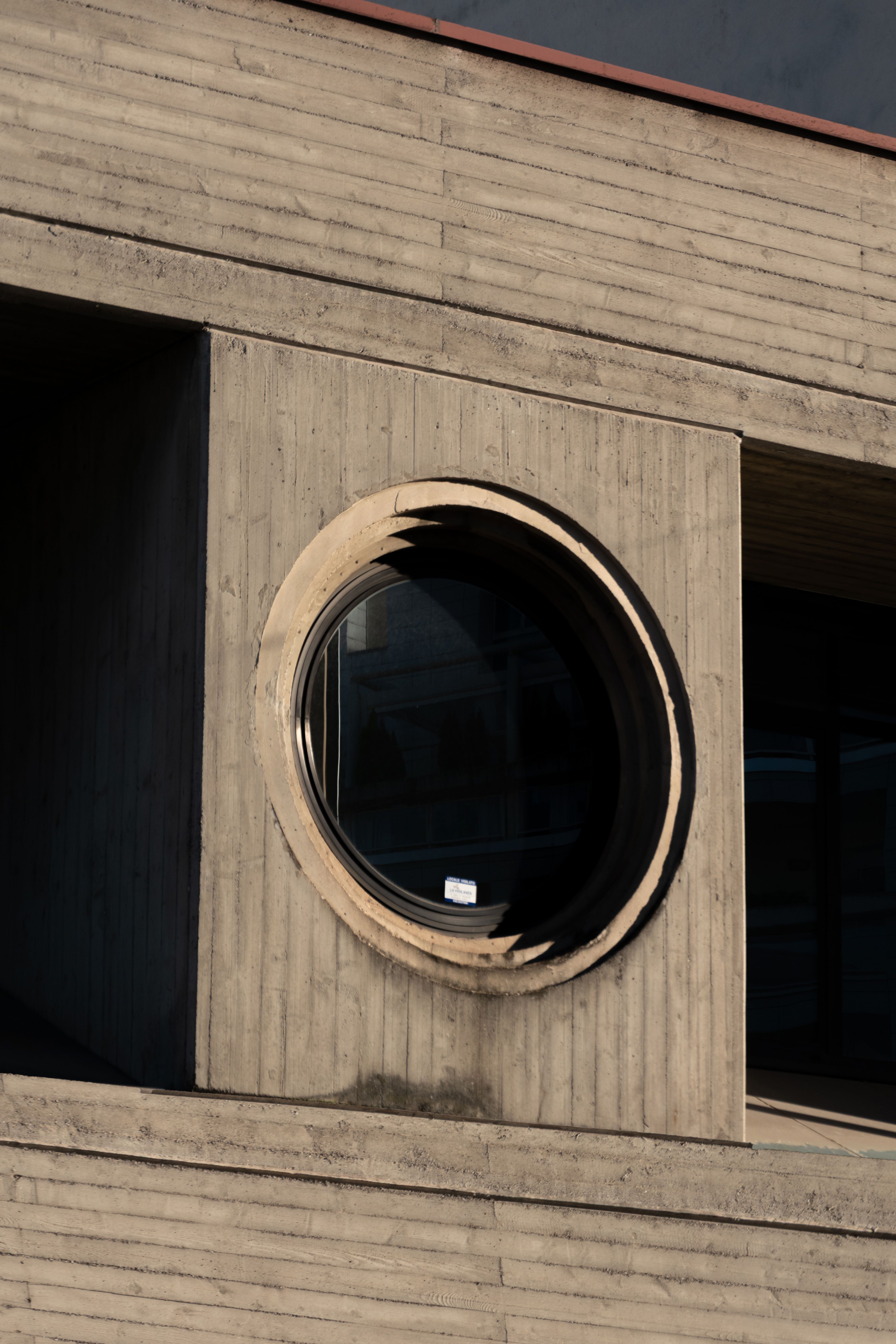 Modern Italian Architectural Design in Circular Window · Free Stock Photo
