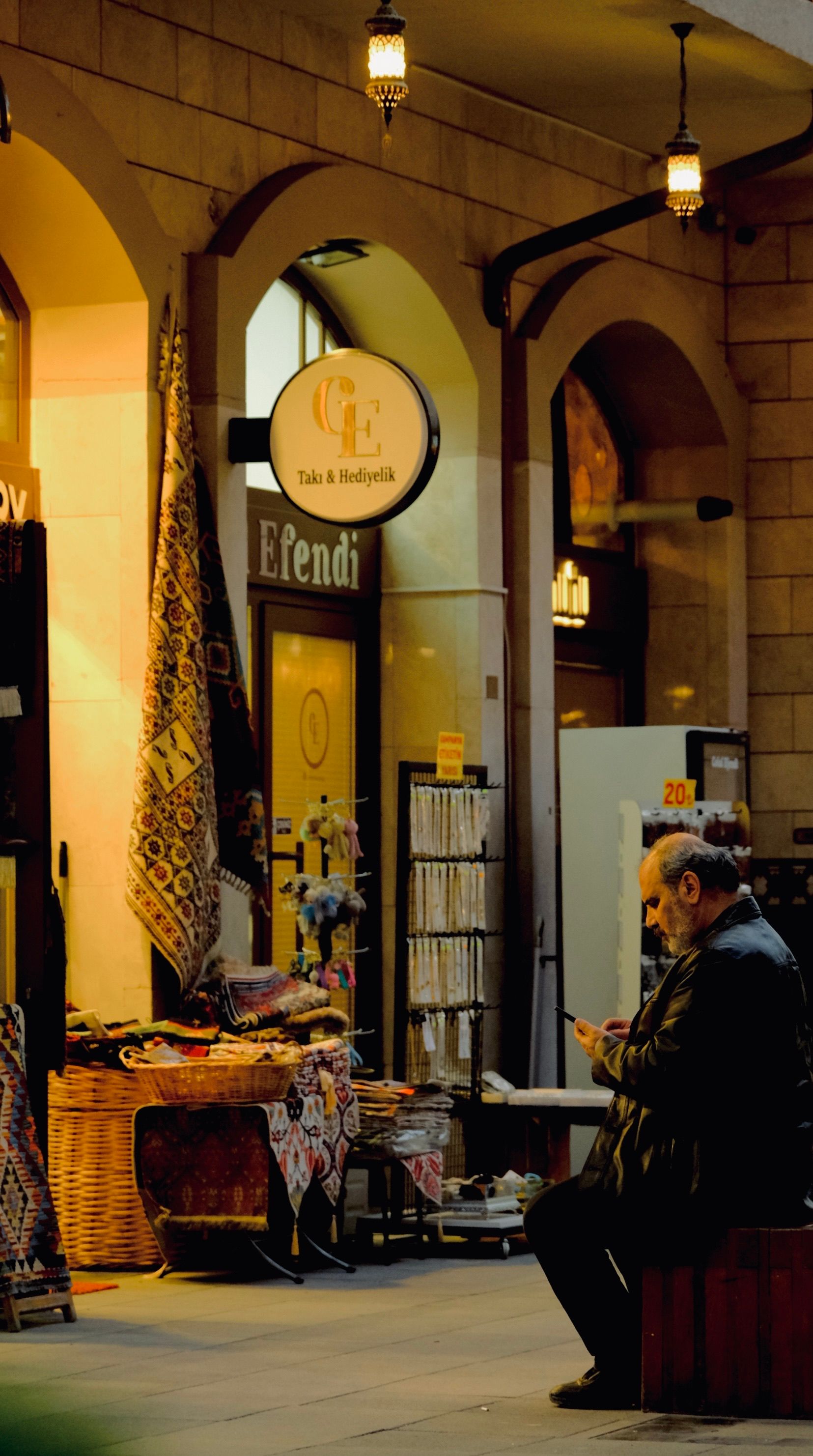 Man Sitting Outside a Traditional Bazaar Shop · Free Stock Photo