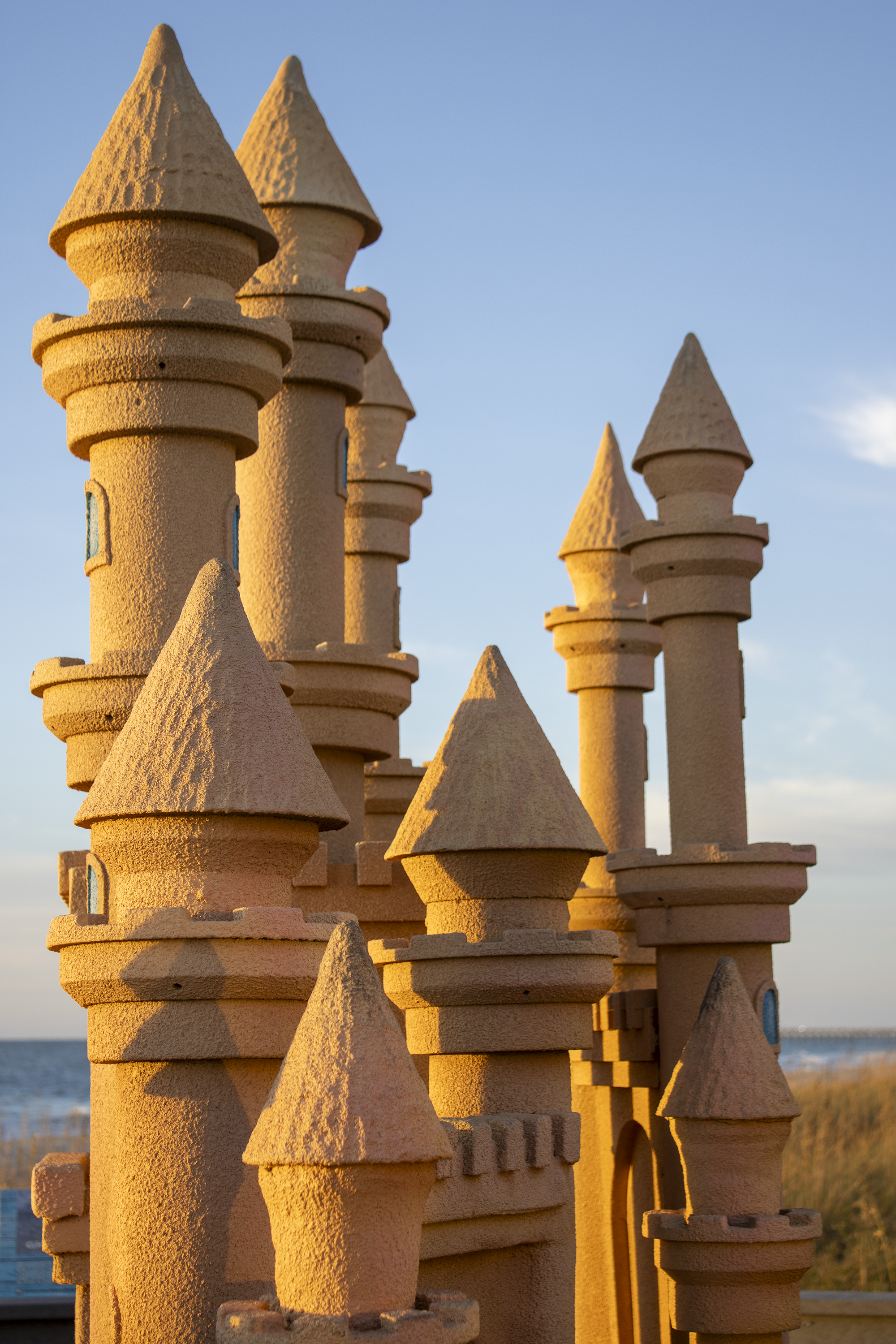 Sandy Castle Sculpture by the Seaside at Sunset · Free Stock Photo