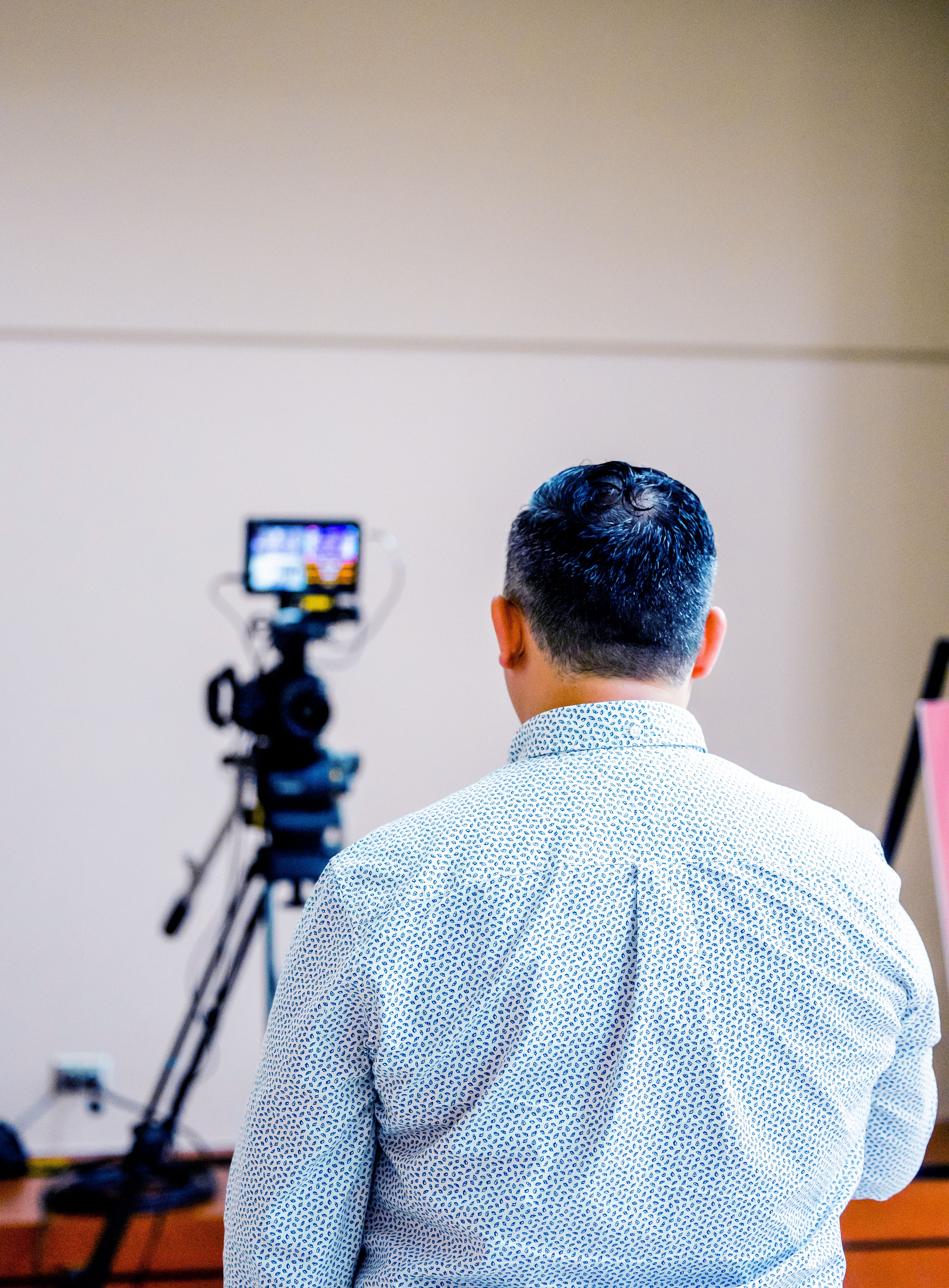 Videographer Preparing for Studio Shoot · Free Stock Photo
