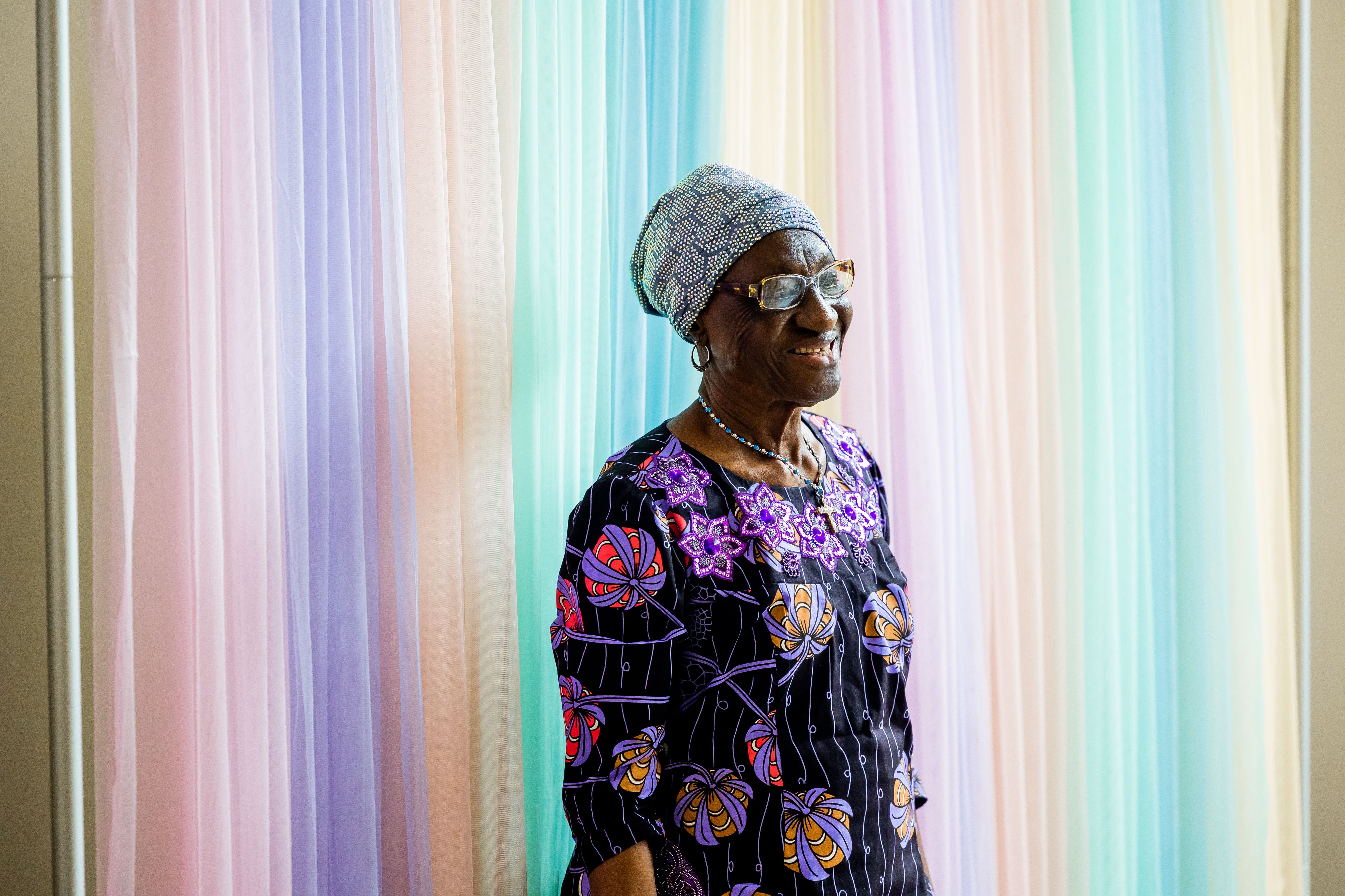 Smiling Senior Woman in Colorful Outfit · Free Stock Photo
