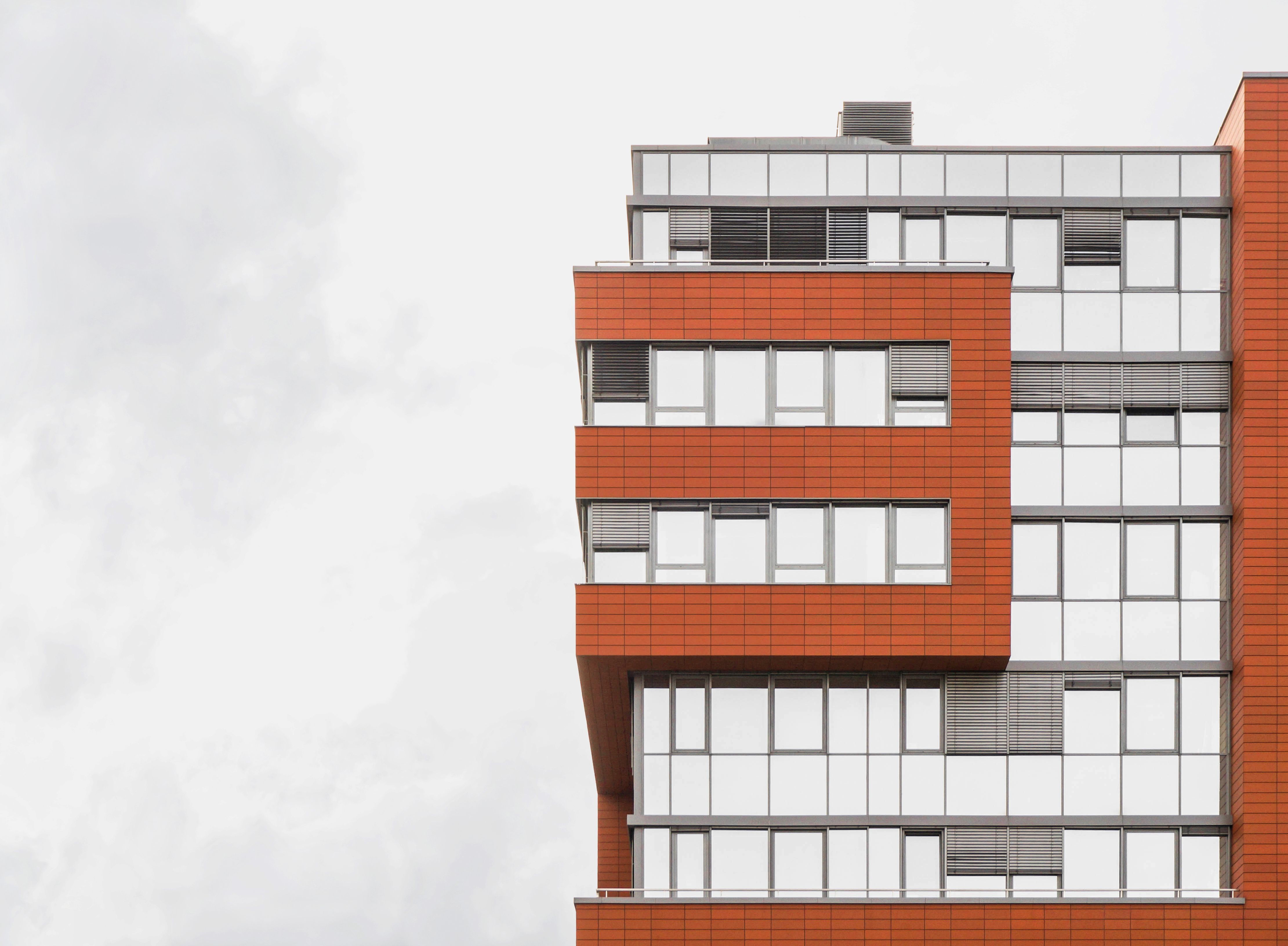 Modern Minimalist Building with Orange Facade · Free Stock Photo