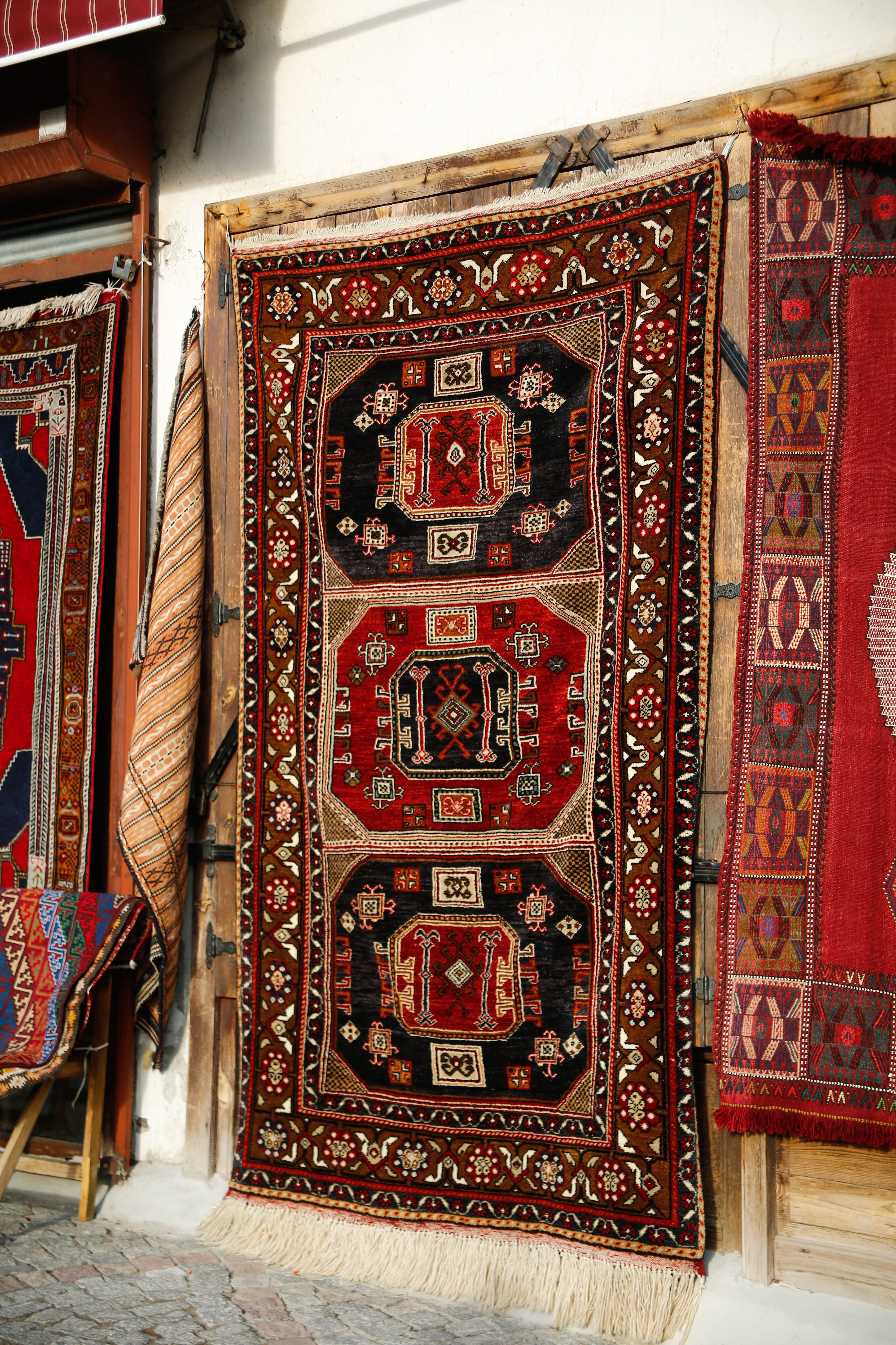 Traditional Turkish Carpet Displayed Outdoors · Free Stock Photo