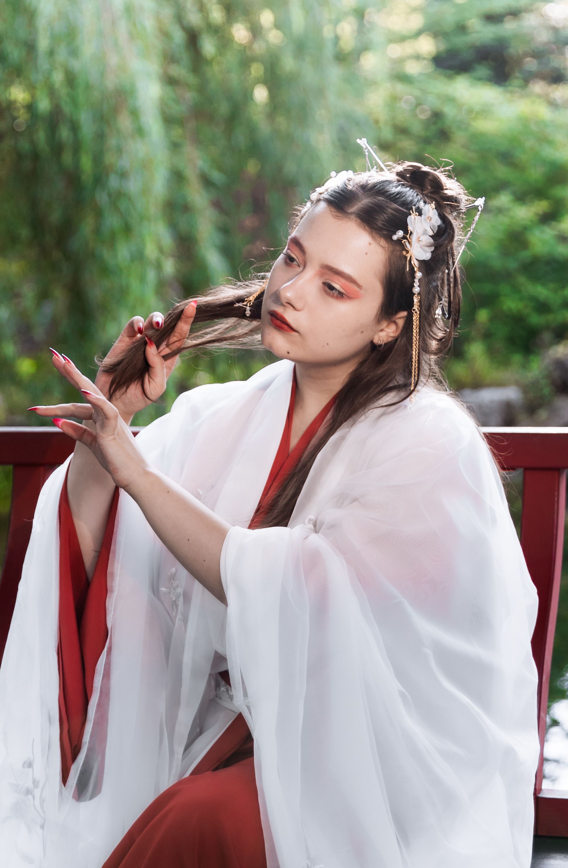 Traditional Asian-Inspired Attire in a Tranquil Garden · Free Stock Photo