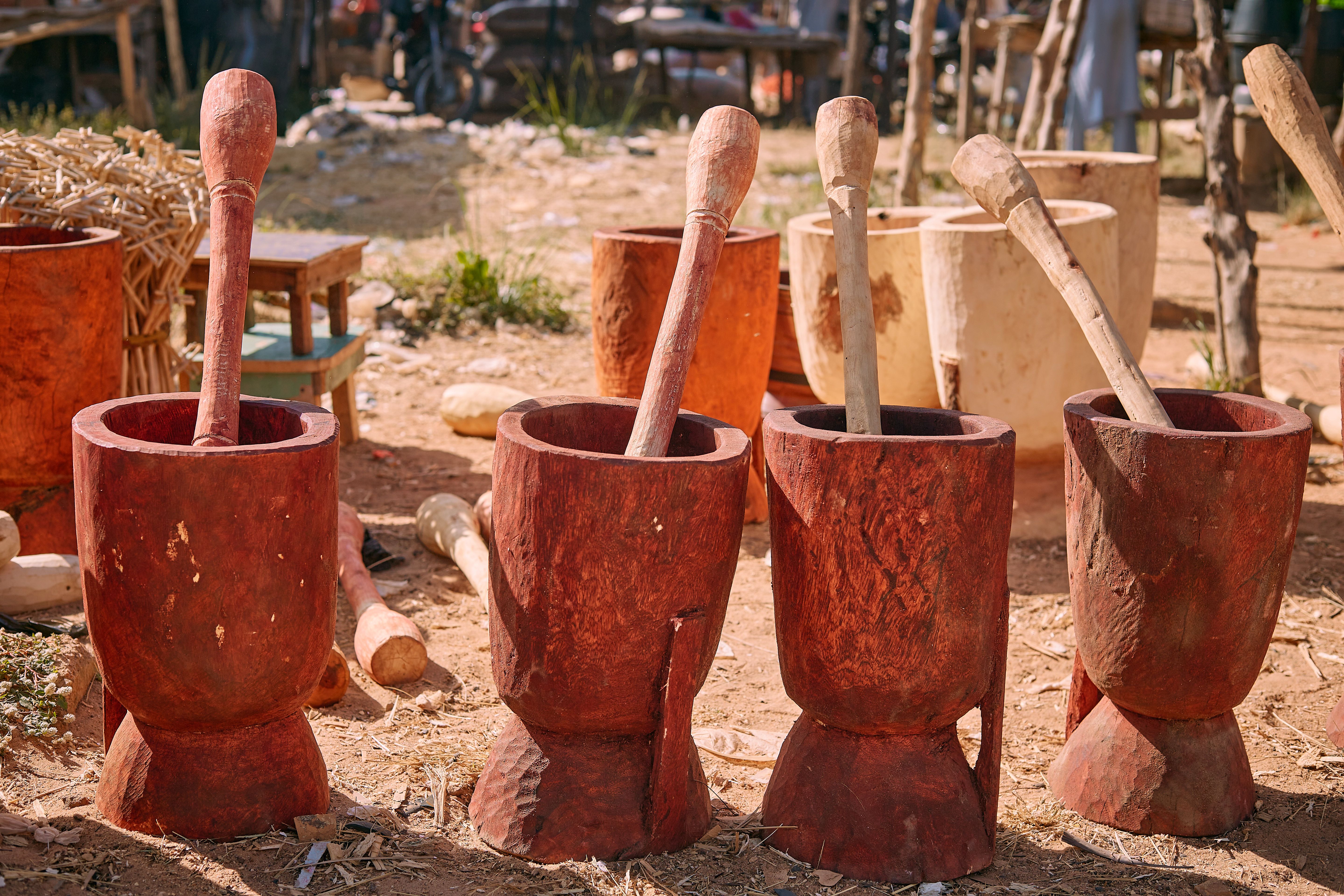 Traditional Wooden Mortars in Nigerian Market · Free Stock Photo