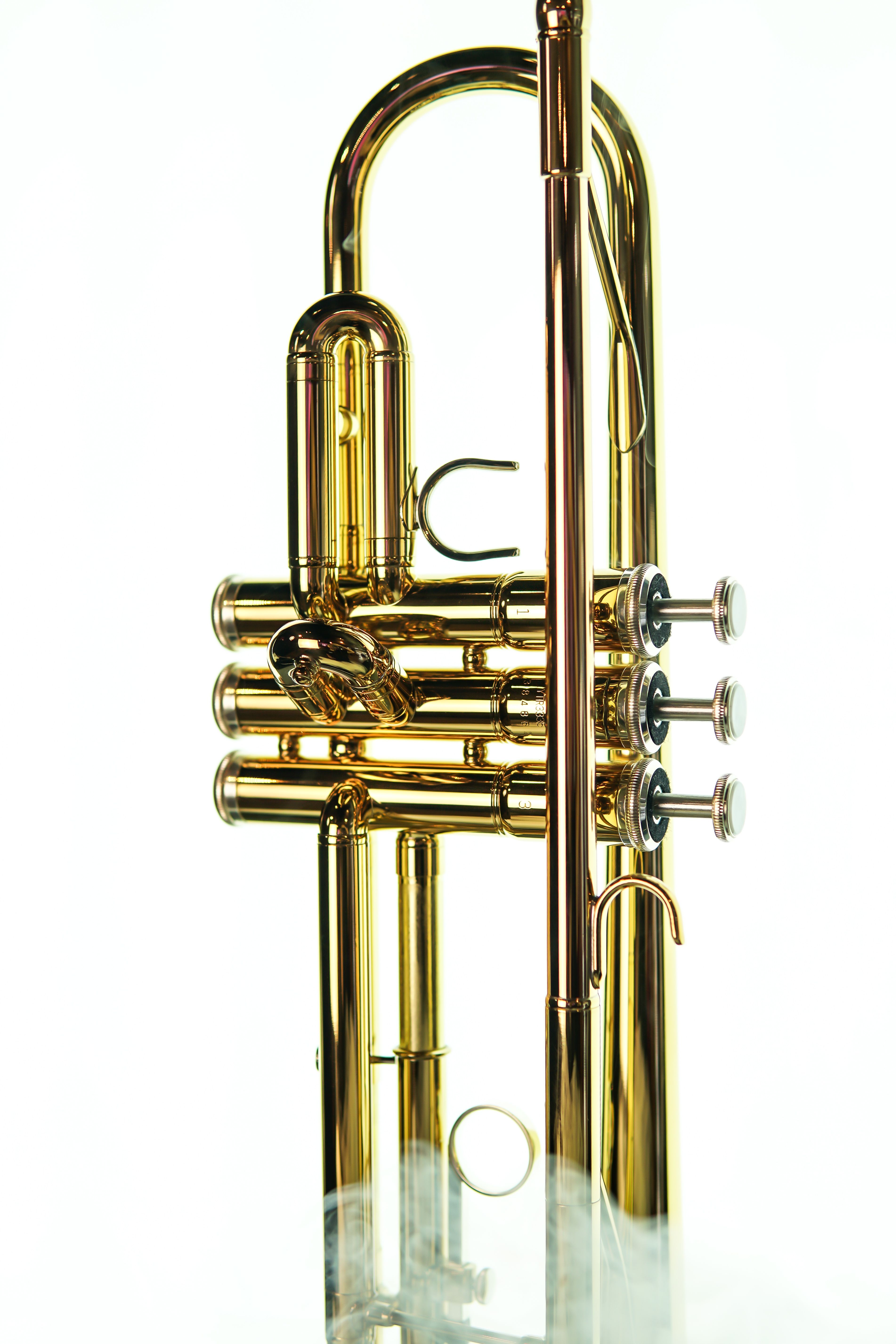 Elegant Gold Trumpet Isolated on White Background · Free Stock Photo