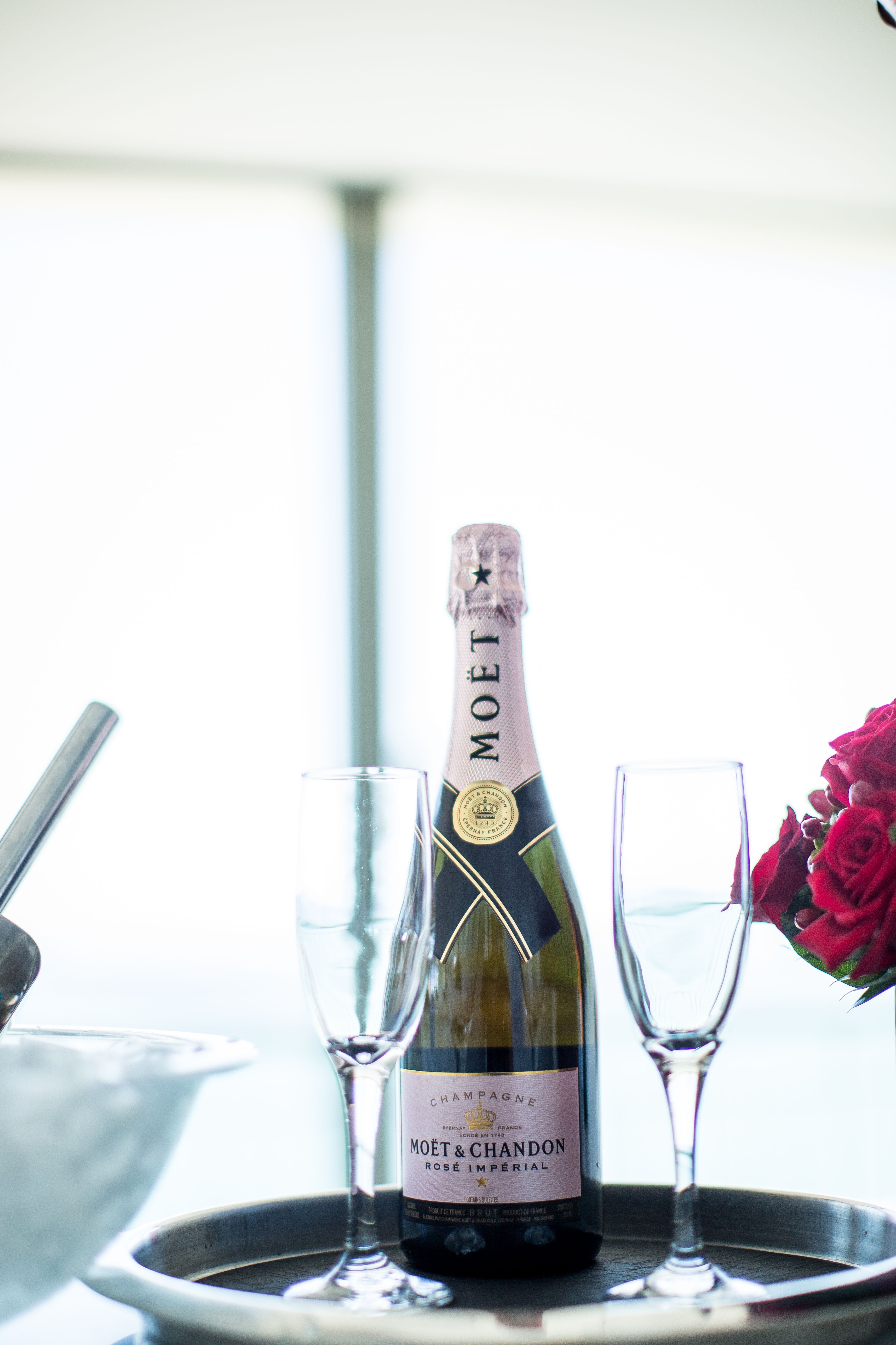 Elegant Champagne Celebration with Roses and Glasses · Free Stock Photo