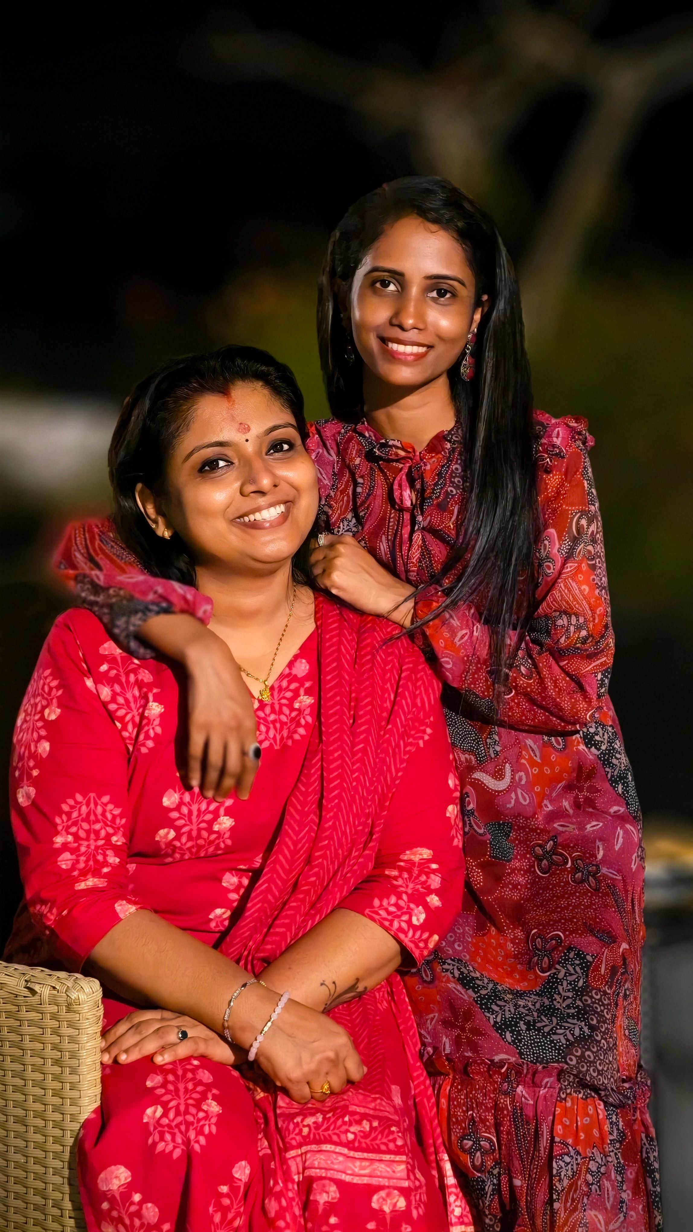 Mother and Daughter in Traditional Attire · Free Stock Photo