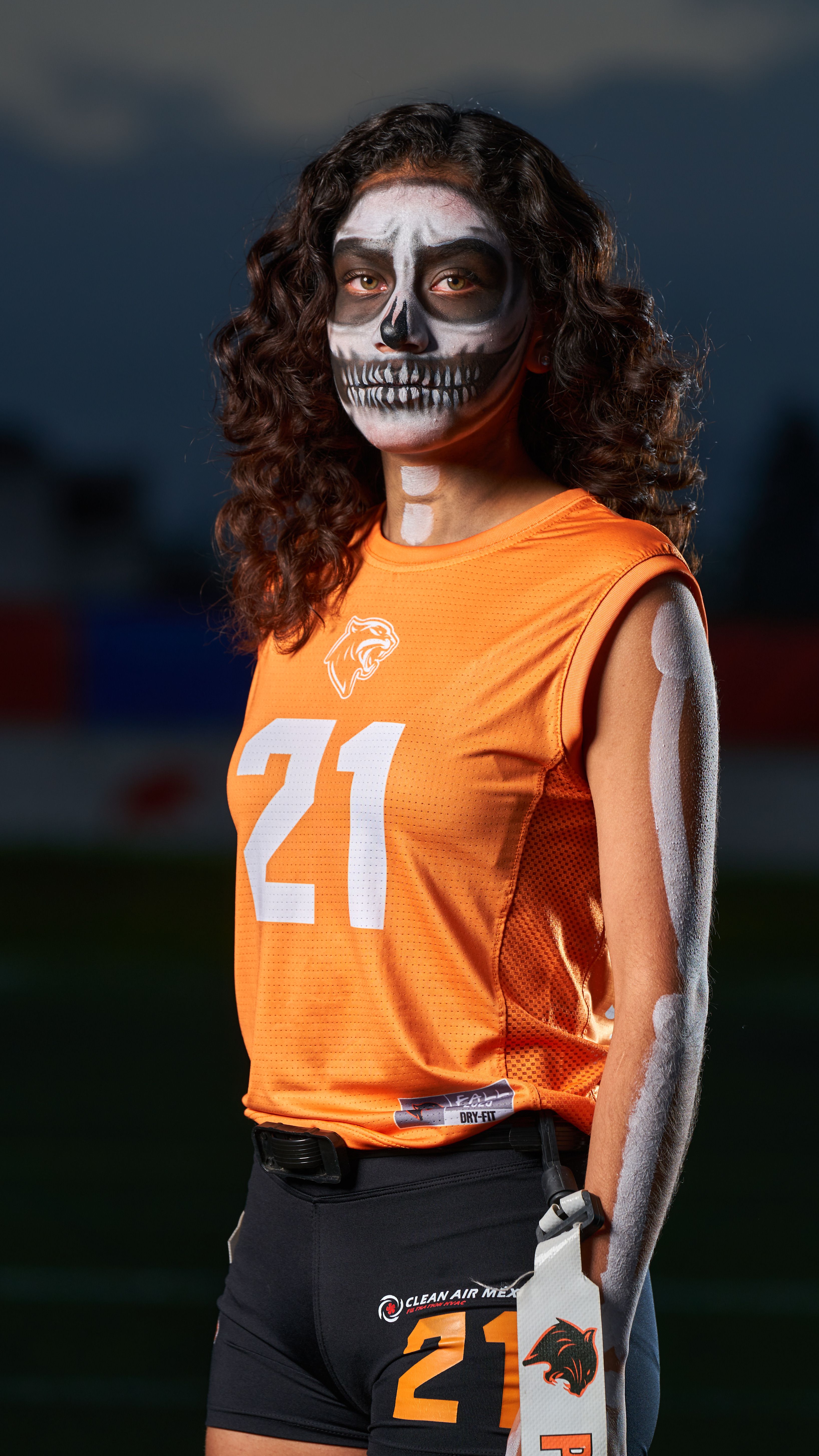 Football Player with Face Paint at Dusk · Free Stock Photo