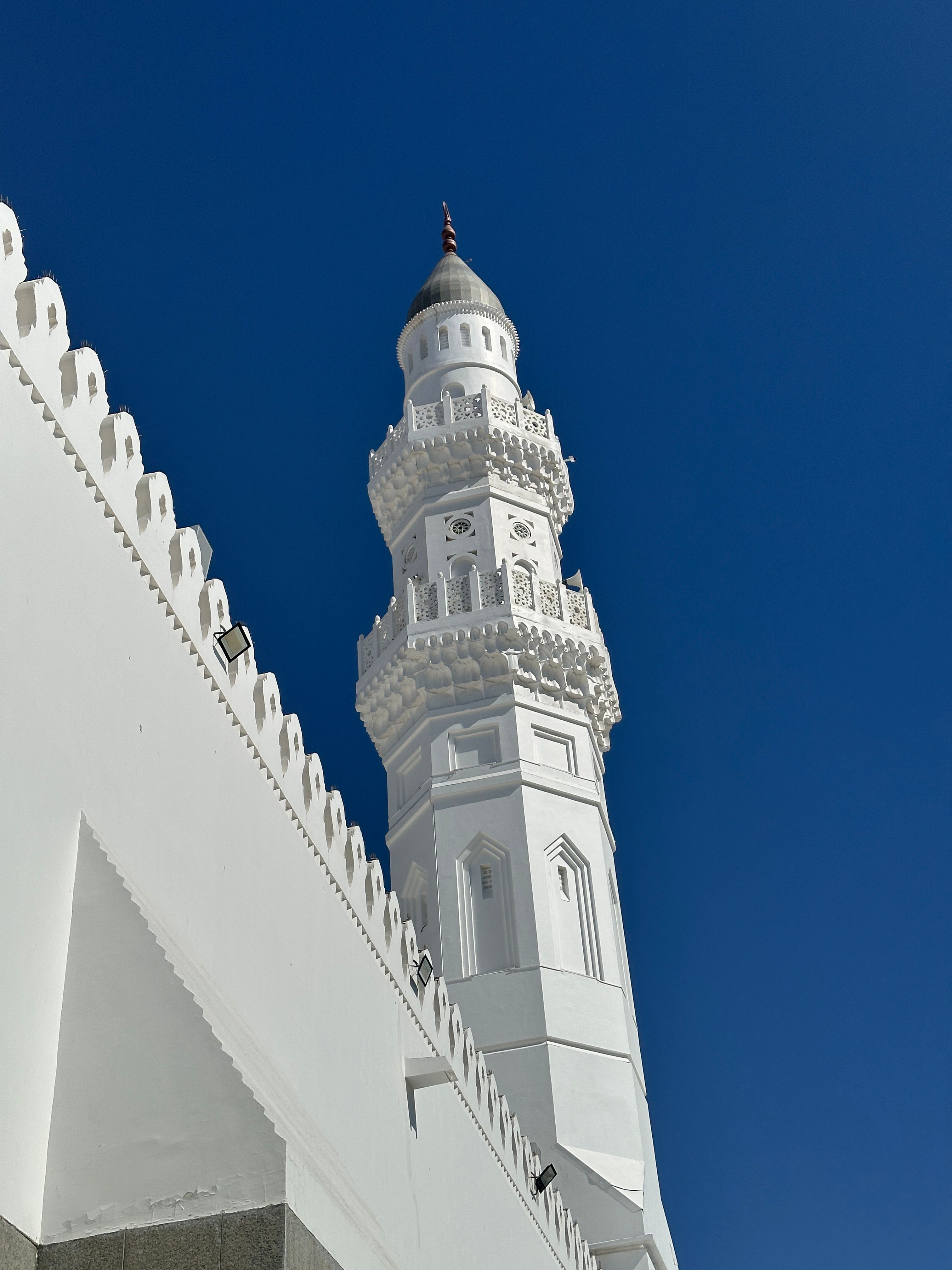 Majestic White Minaret Against Blue Sky · Free Stock Photo