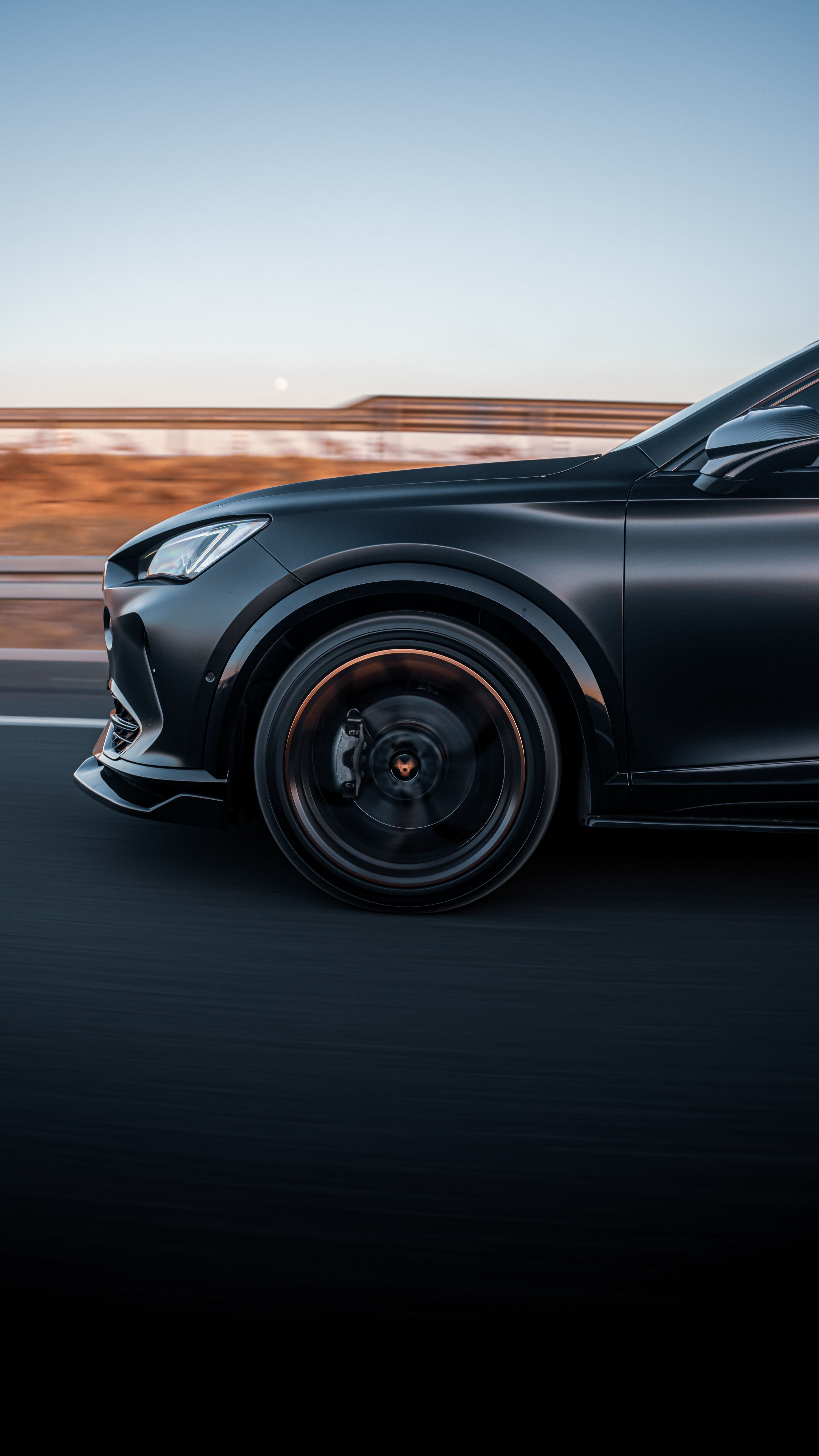 Sleek Black Car in Motion on Highway · Free Stock Photo