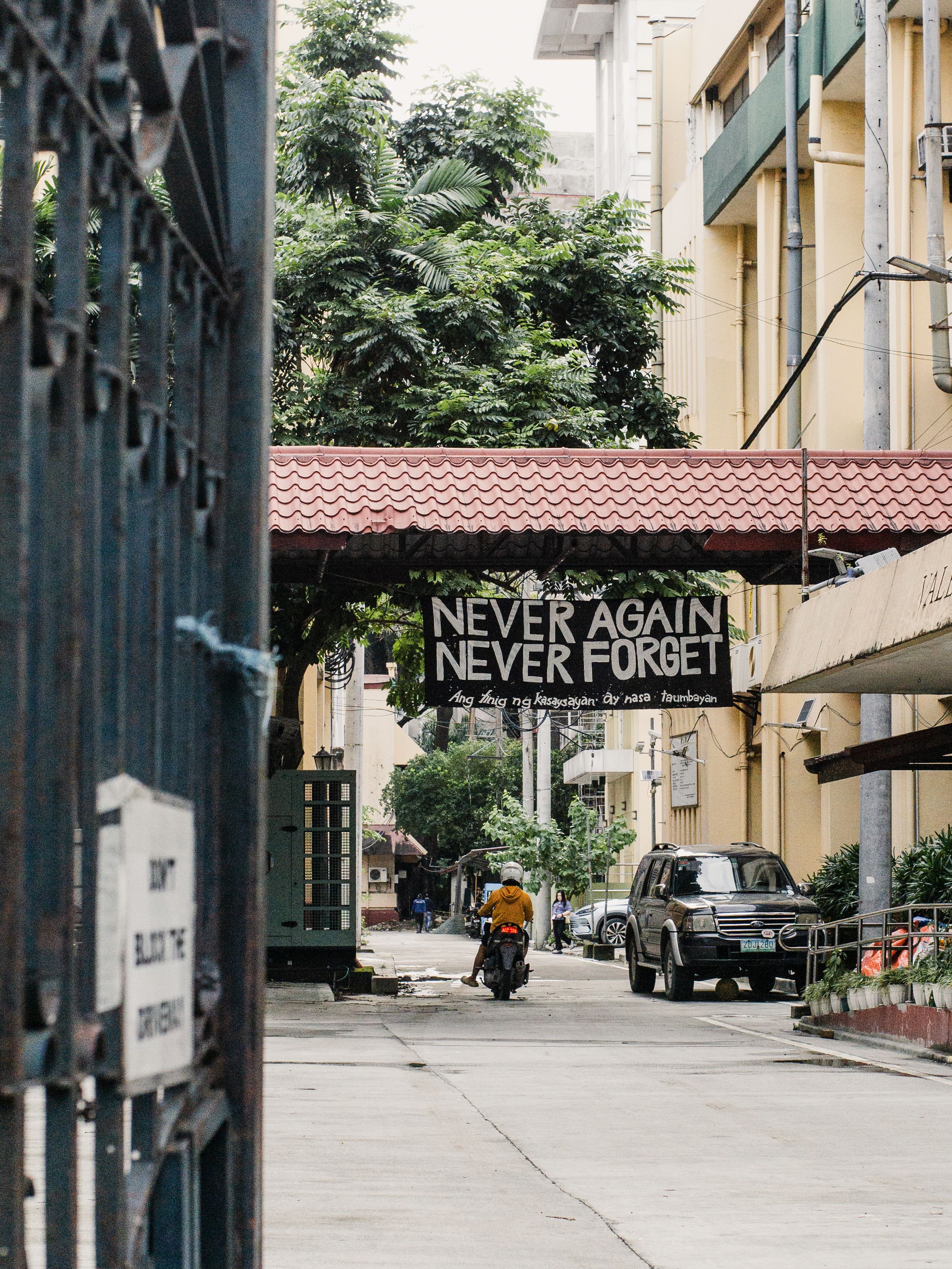 Protest Sign in Urban Manila Street Scene · Free Stock Photo