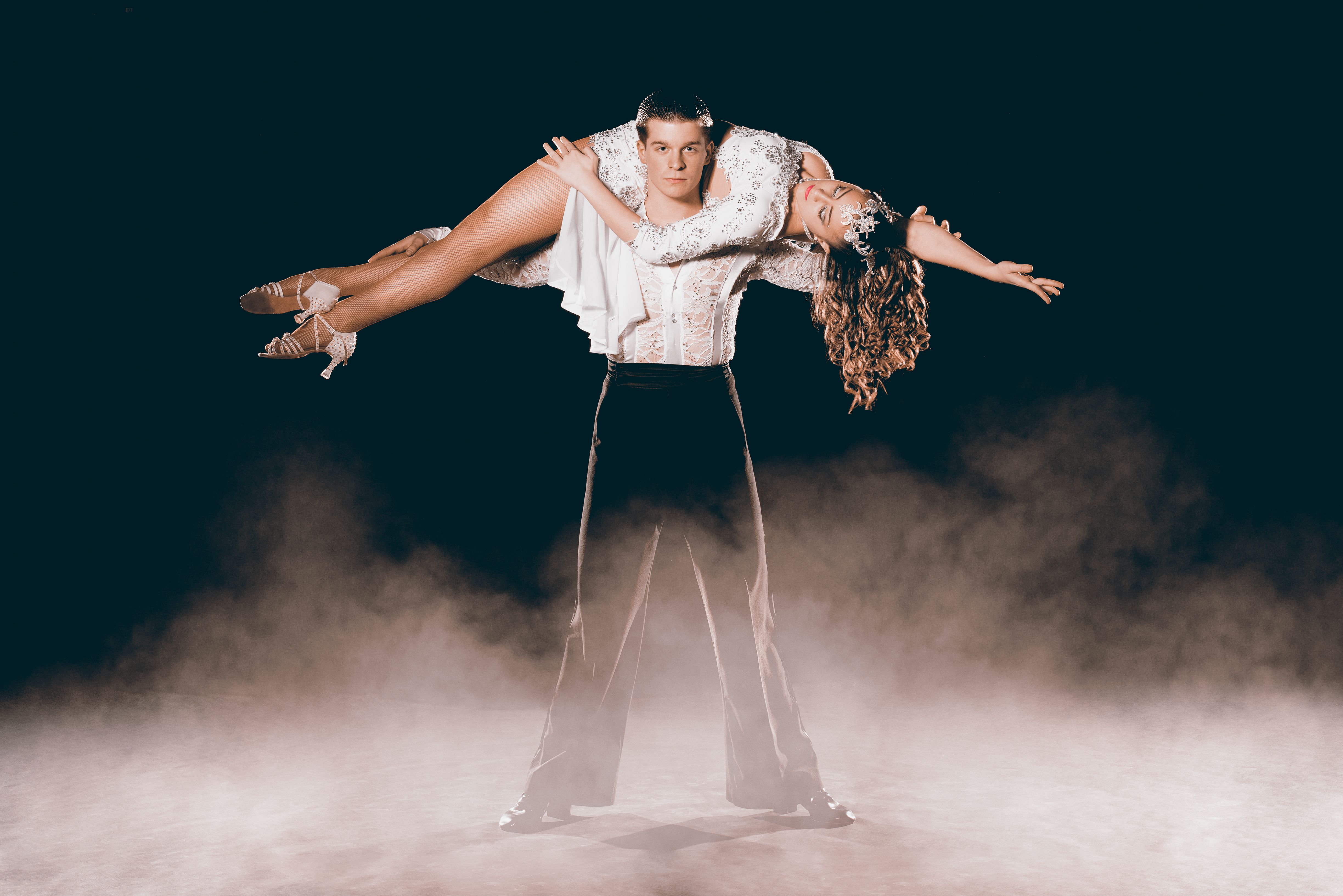 Dancers in Dramatic Pose with Smoky Background · Free Stock Photo