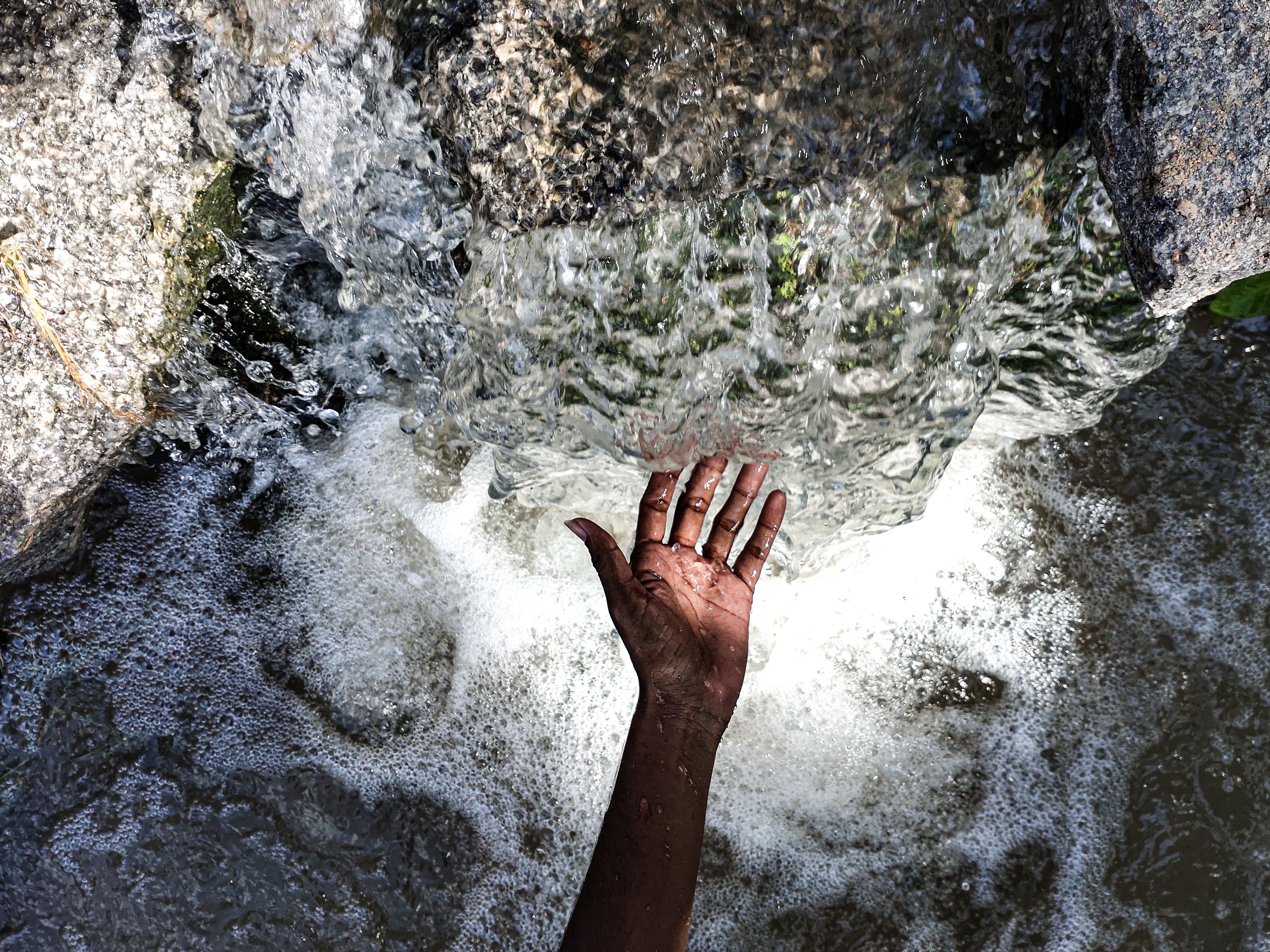 Person Touching Water · Free Stock Photo