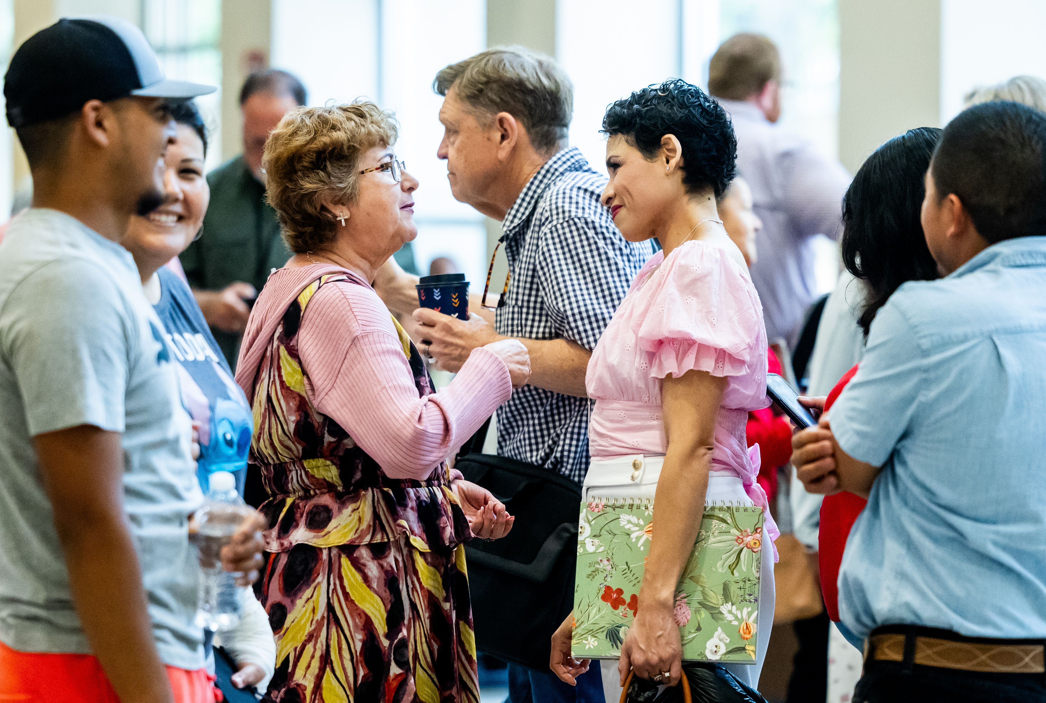 Diverse Group of People Socializing Indoors · Free Stock Photo