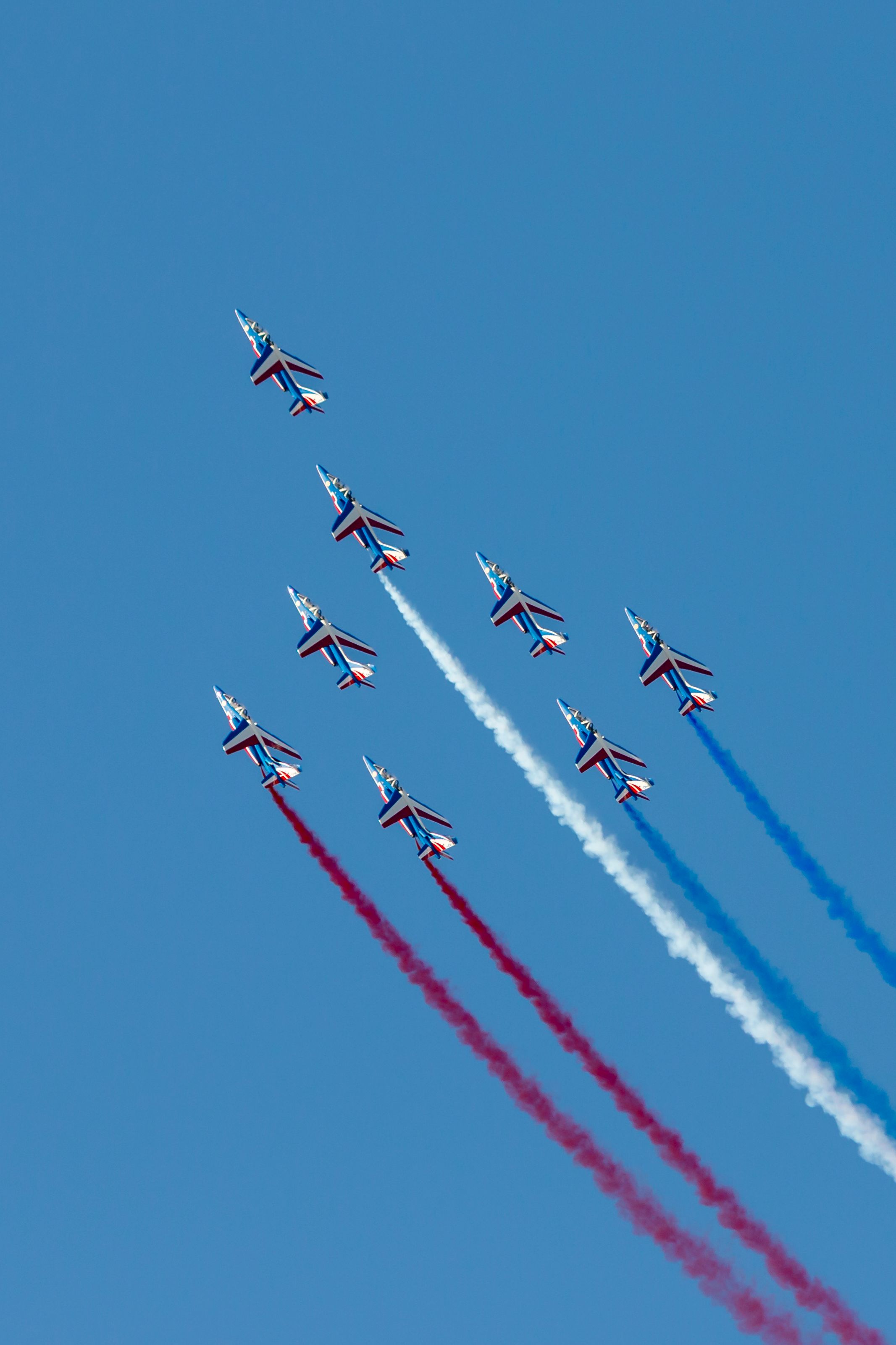 French Aerobatic Jets Performing in Blue Sky · Free Stock Photo