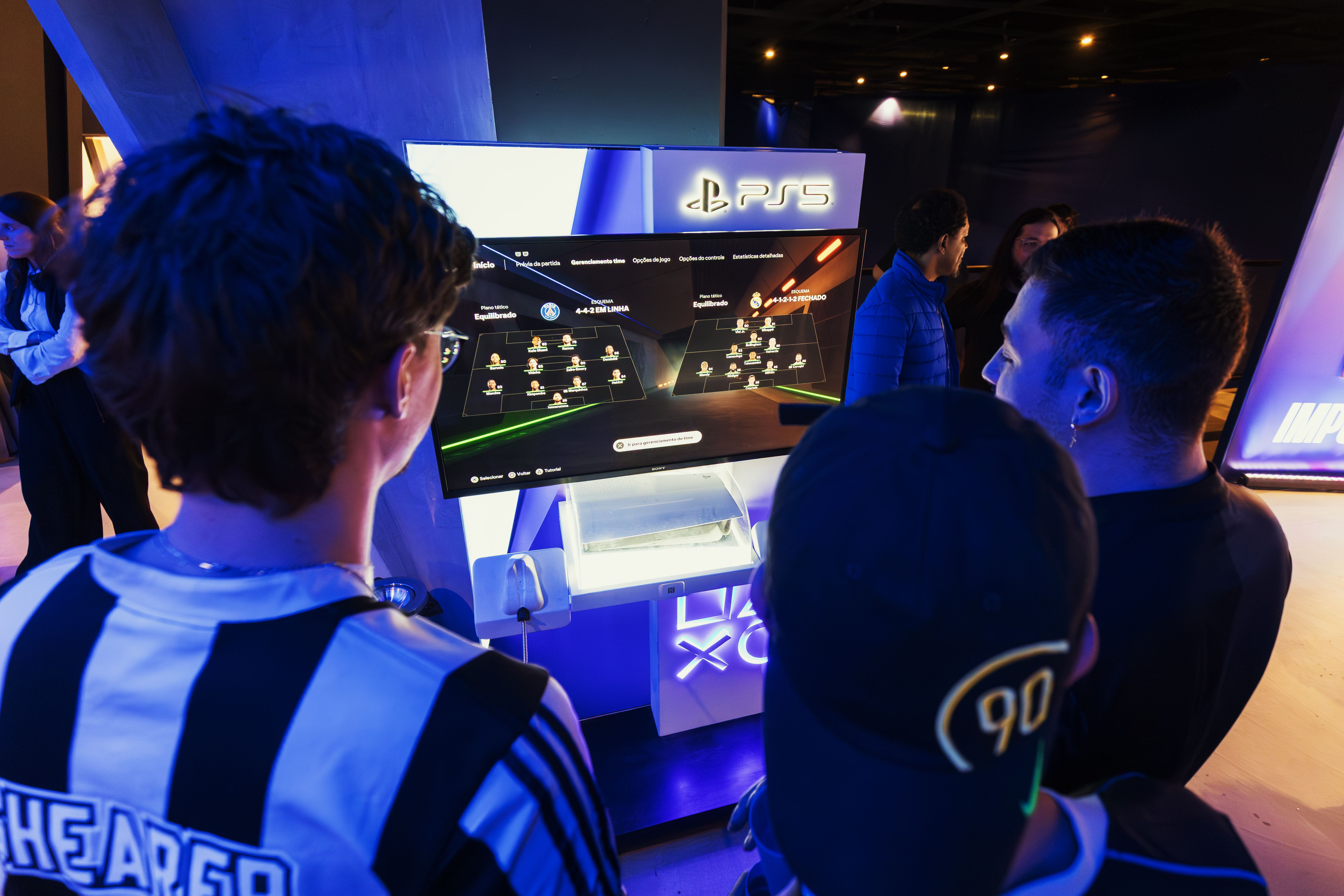 Excited Gamers at PlayStation 5 Gaming Event · Free Stock Photo