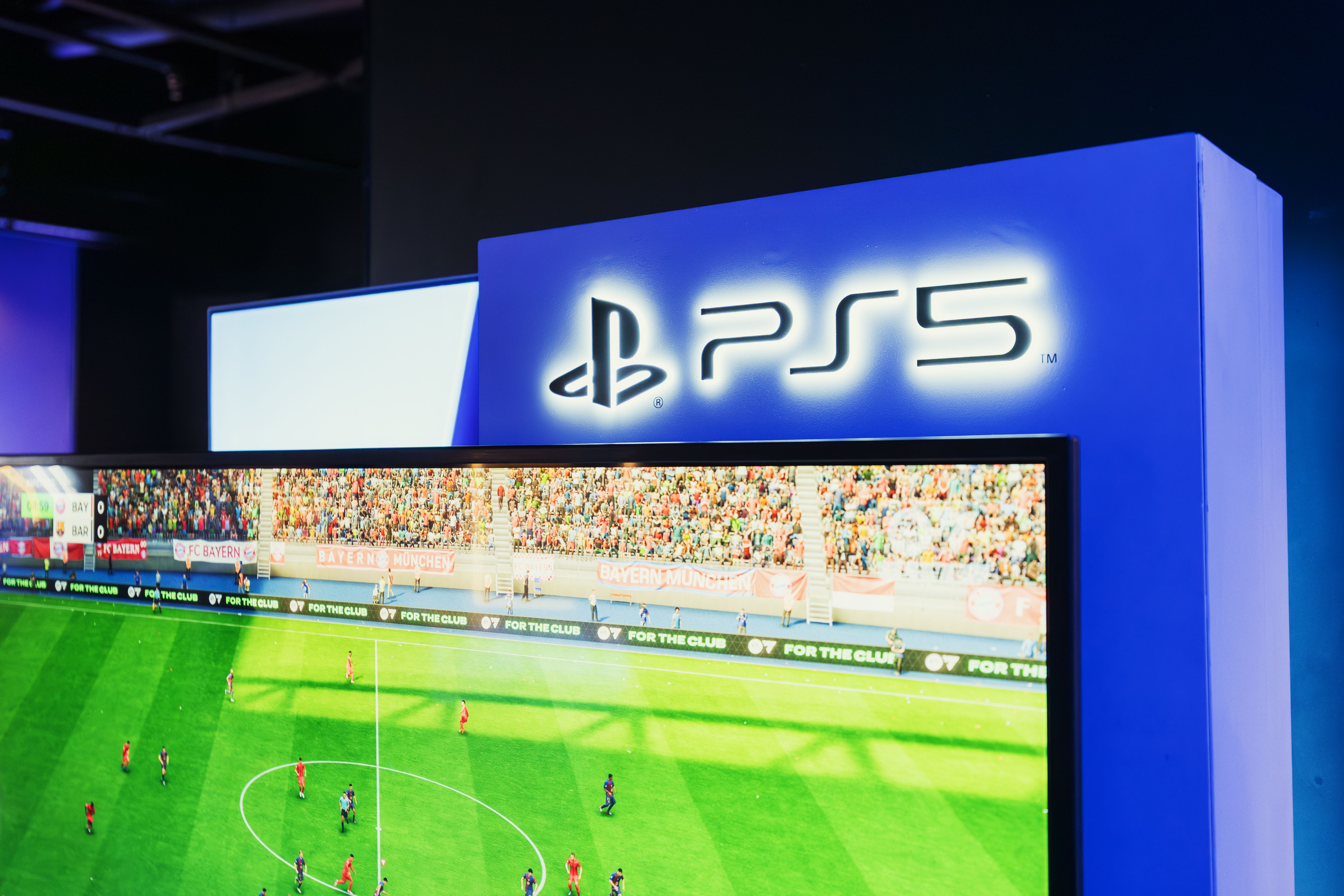 PS5 Gaming Setup with Soccer Match Display · Free Stock Photo