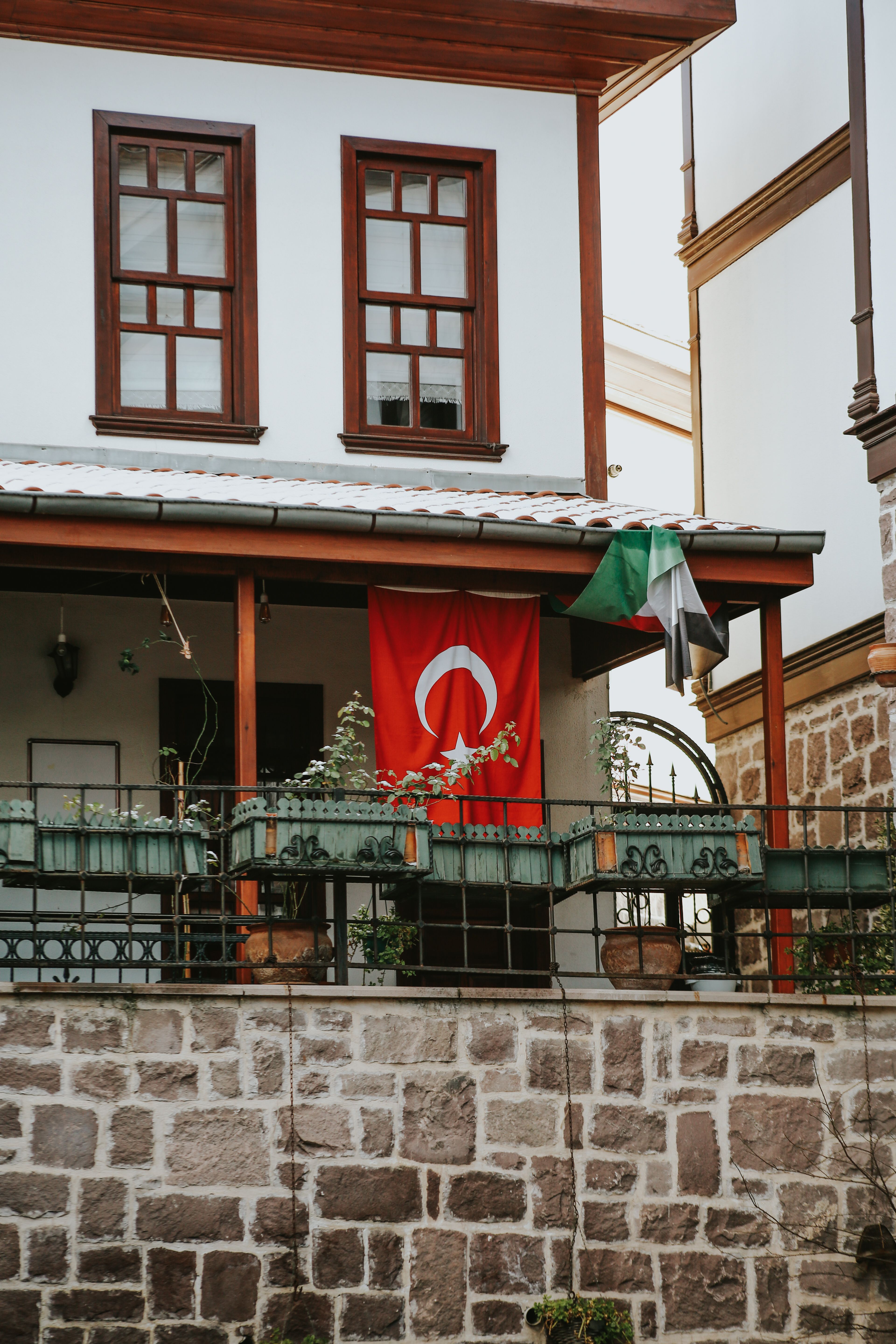 Traditional Turkish House with Flag Display · Free Stock Photo