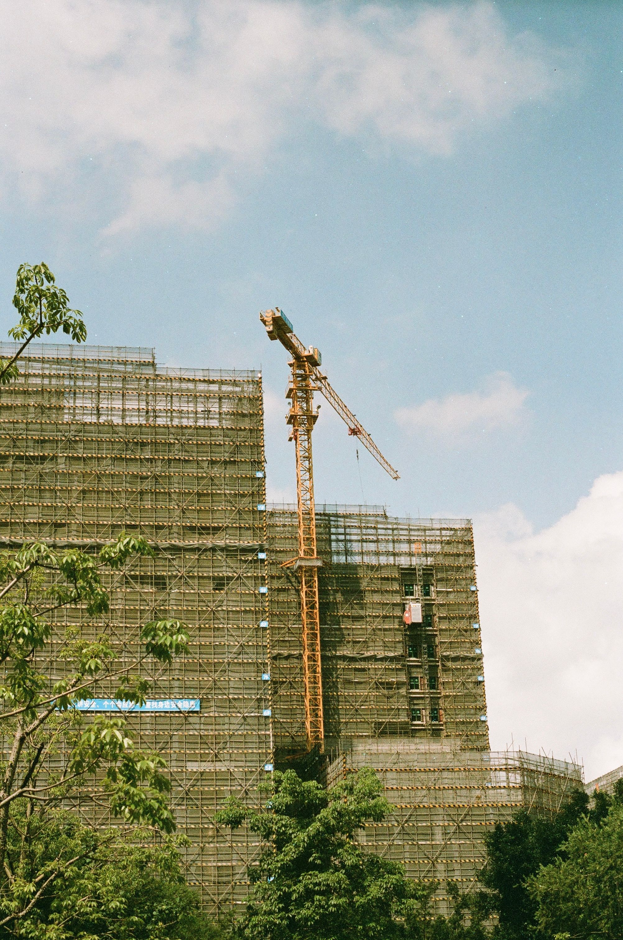 Urban Construction with Crane and Scaffolding · Free Stock Photo