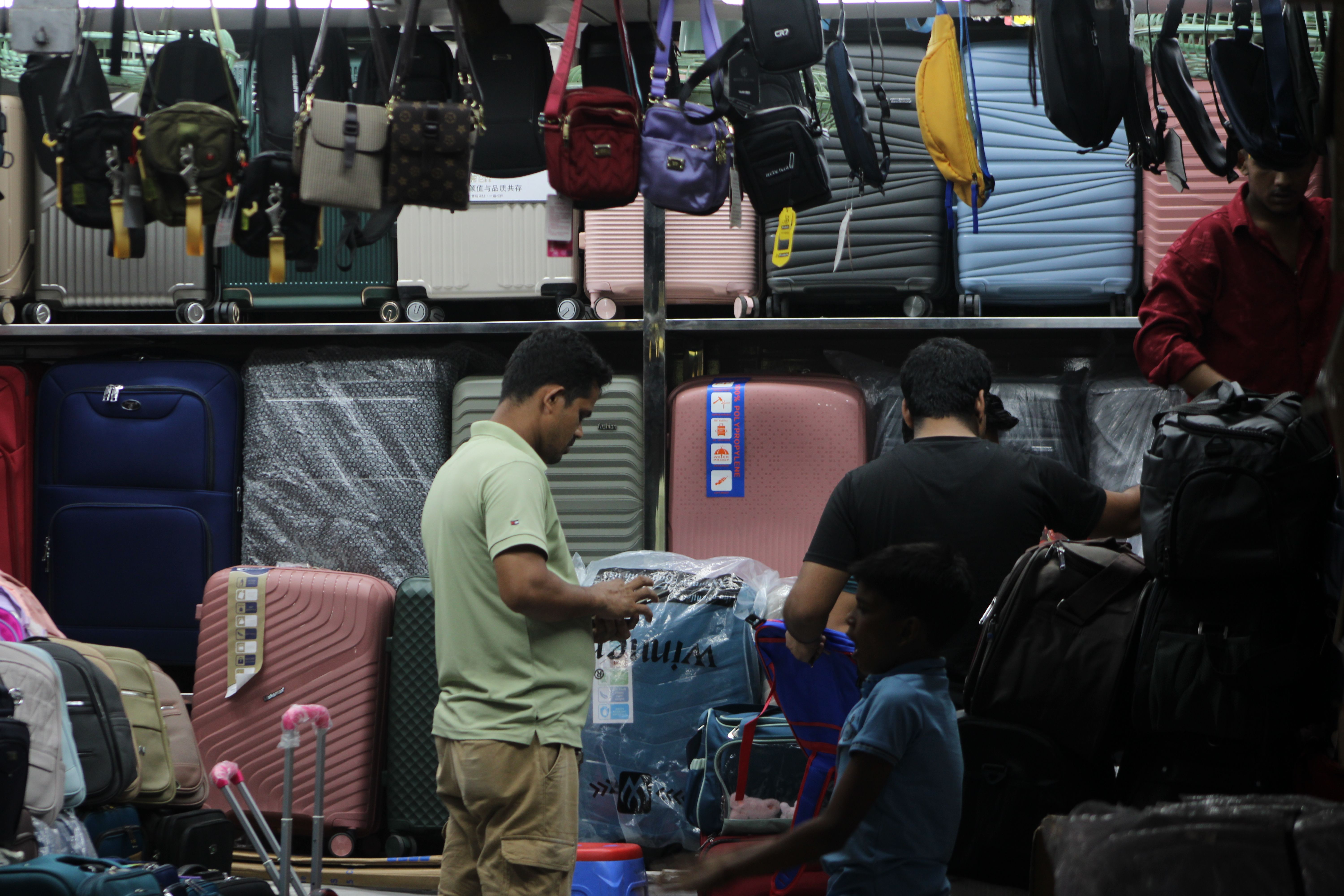 Busy Luggage Shop Scene with Customers · Free Stock Photo