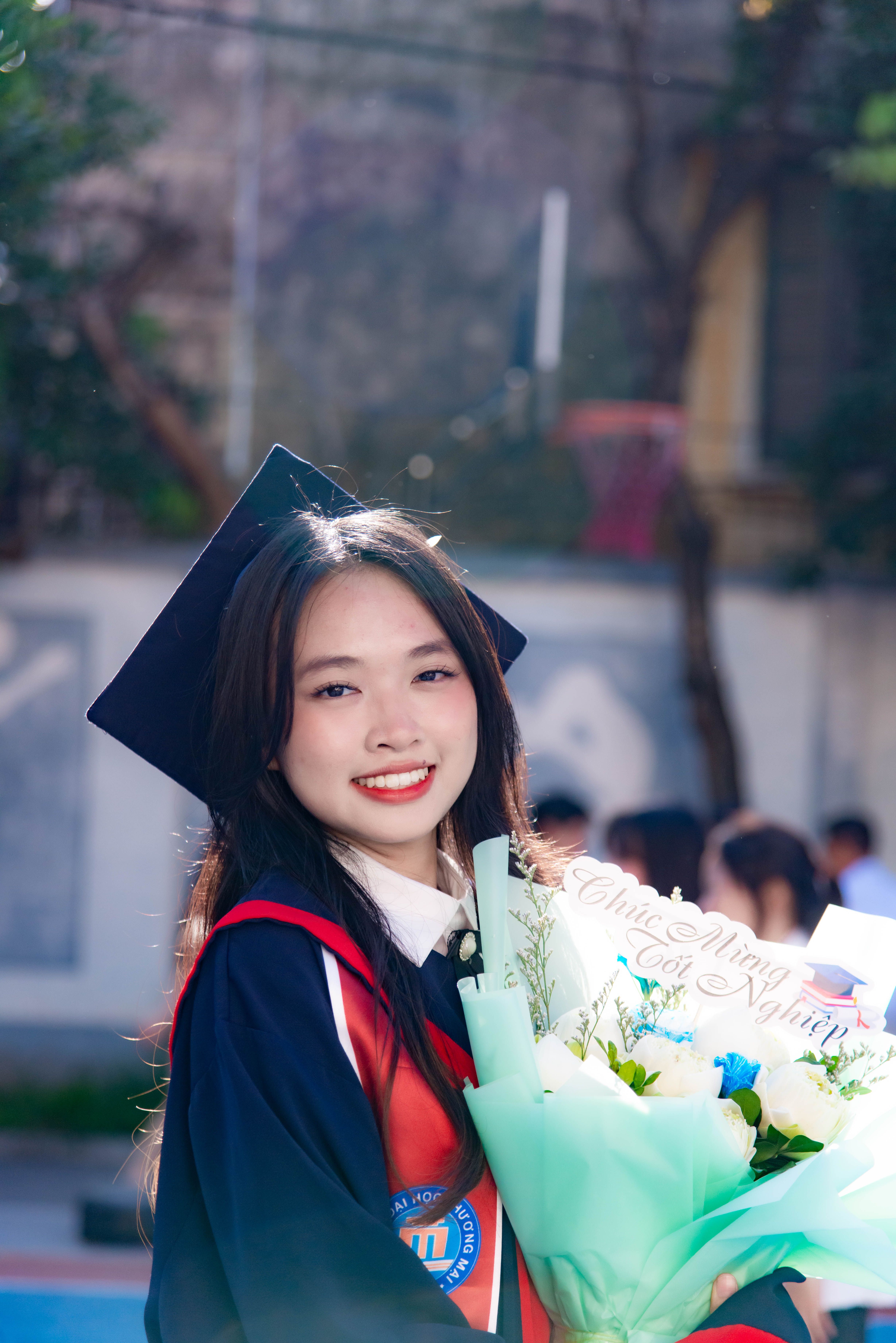 Graduation Day Celebration with Flowers · Free Stock Photo