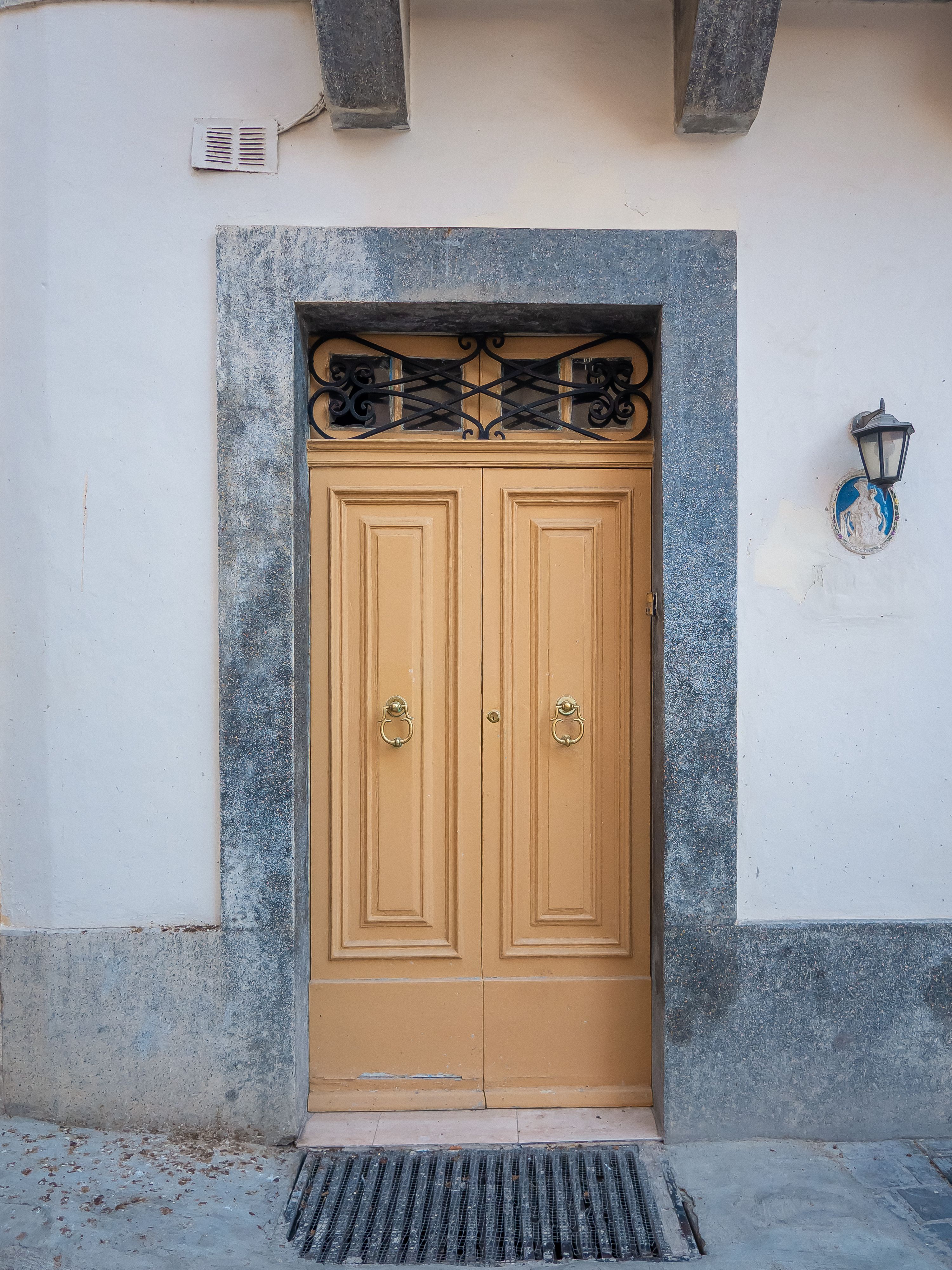 Classic Wooden Door with Stone Frame in Sunny Village · Free Stock Photo