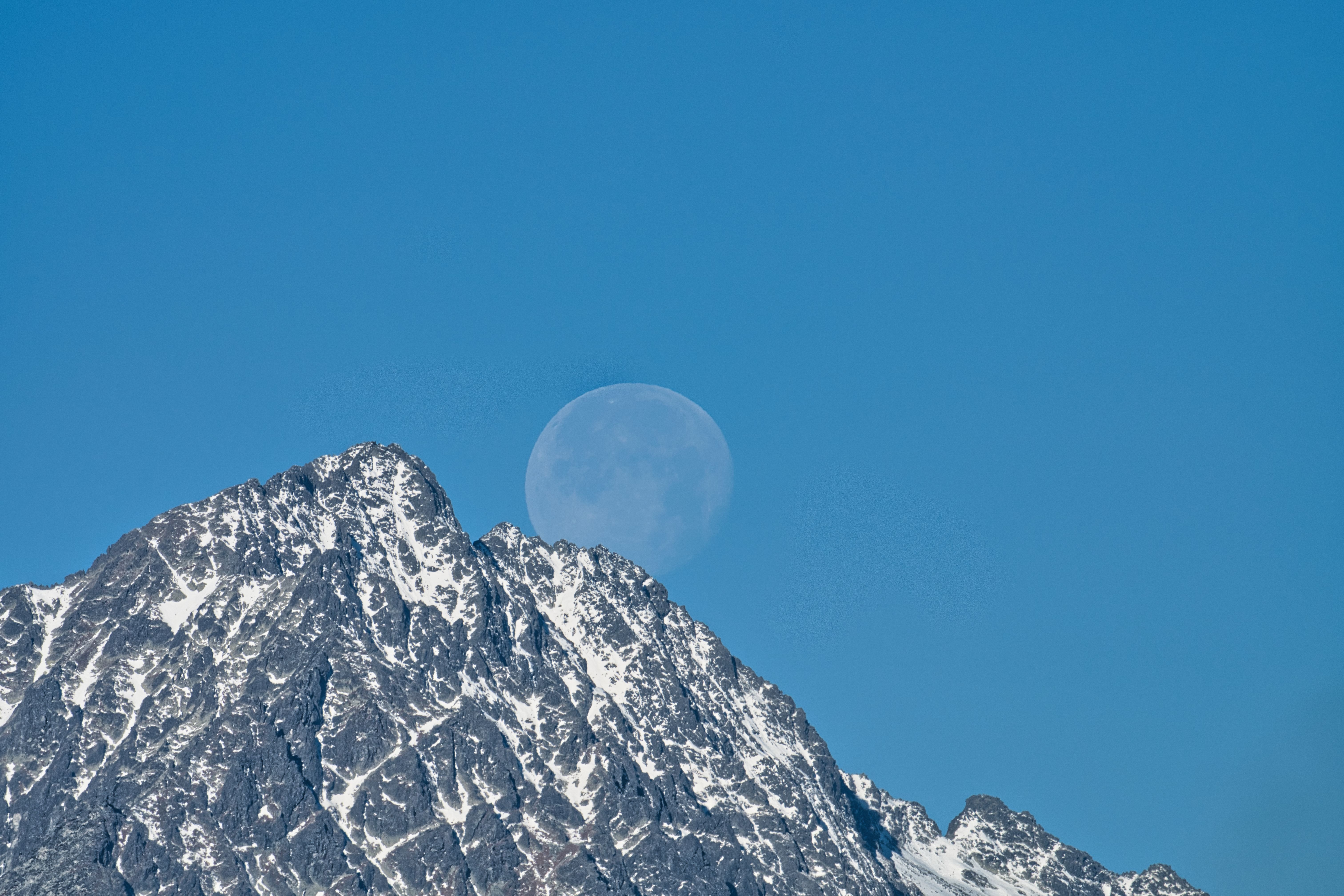 Snow-Capped High Tatras with Lunar Backdrop · Free Stock Photo