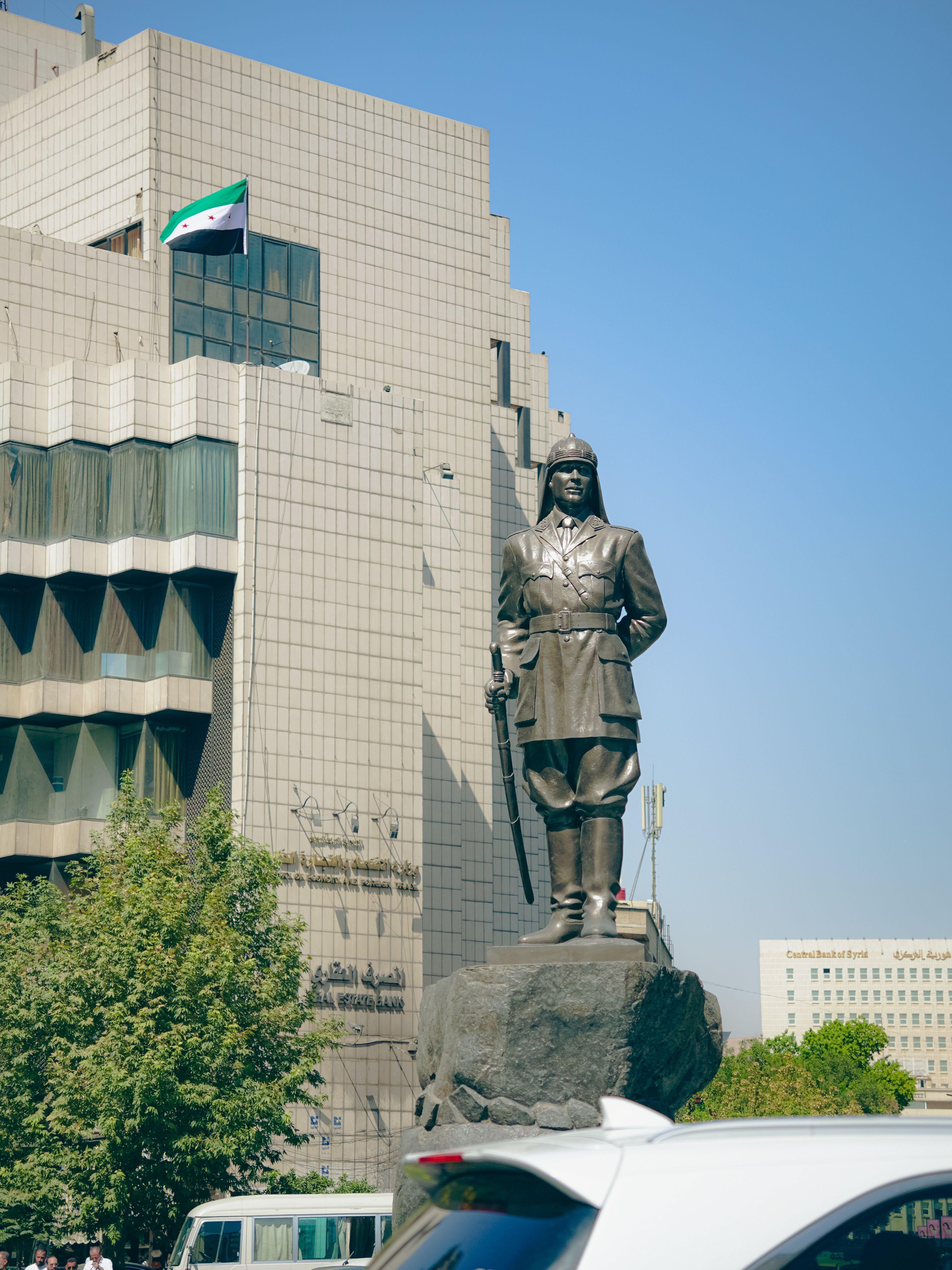 Statue in Damascus with Syrian Flag and Architecture · Free Stock Photo