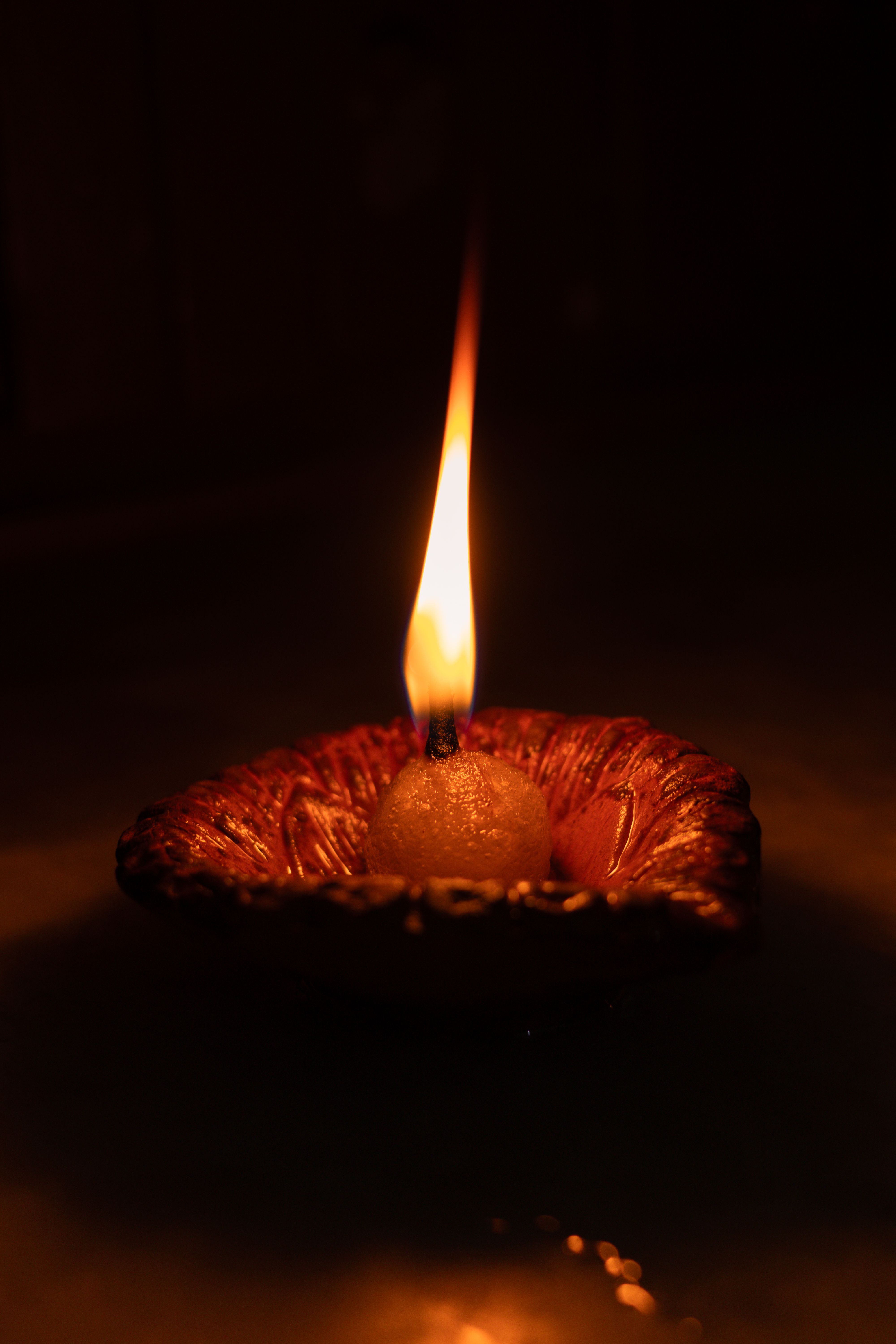Illuminating Traditional Oil Lamp Flame · Free Stock Photo