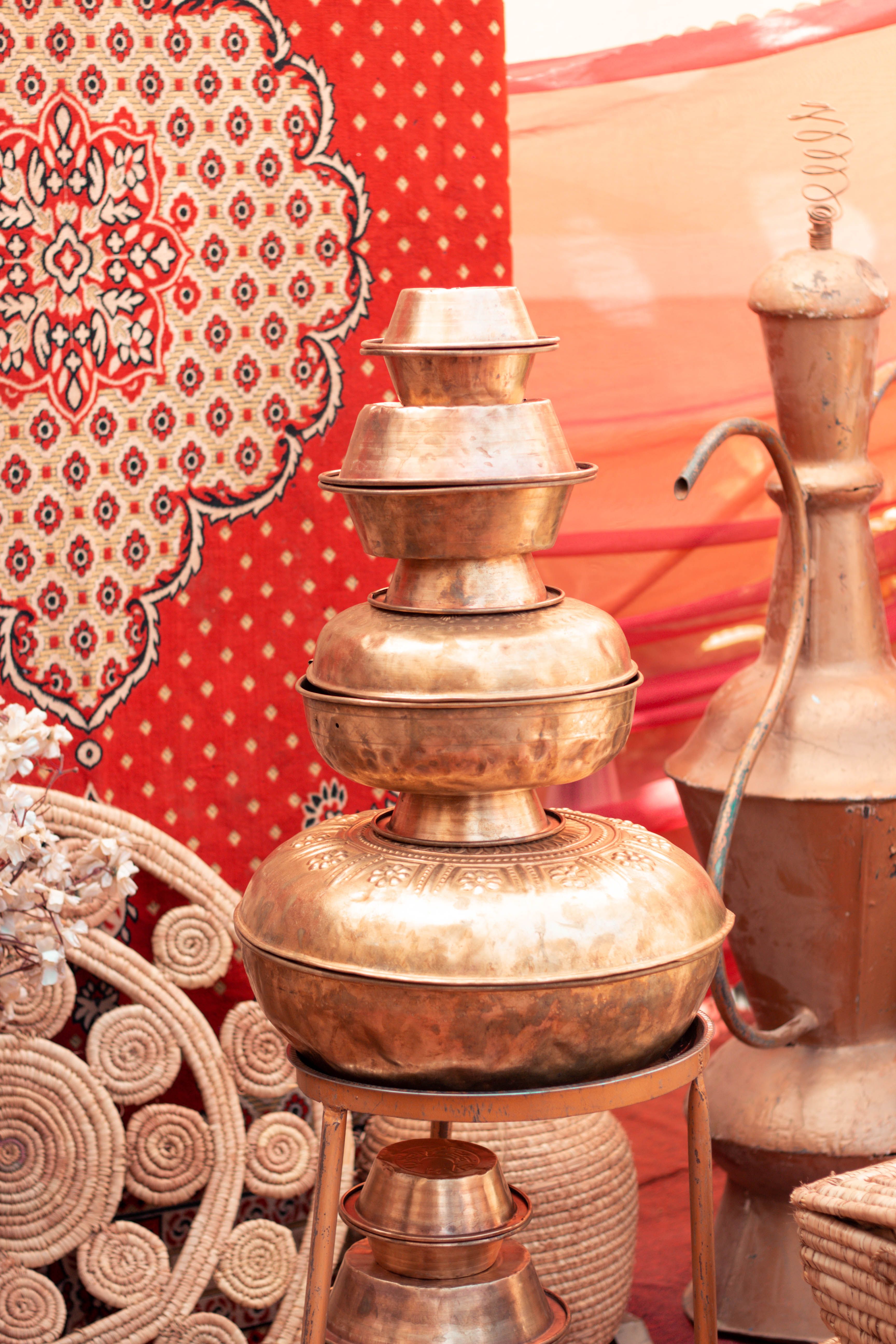 Traditional Copper Pots and Woven Baskets Display · Free Stock Photo
