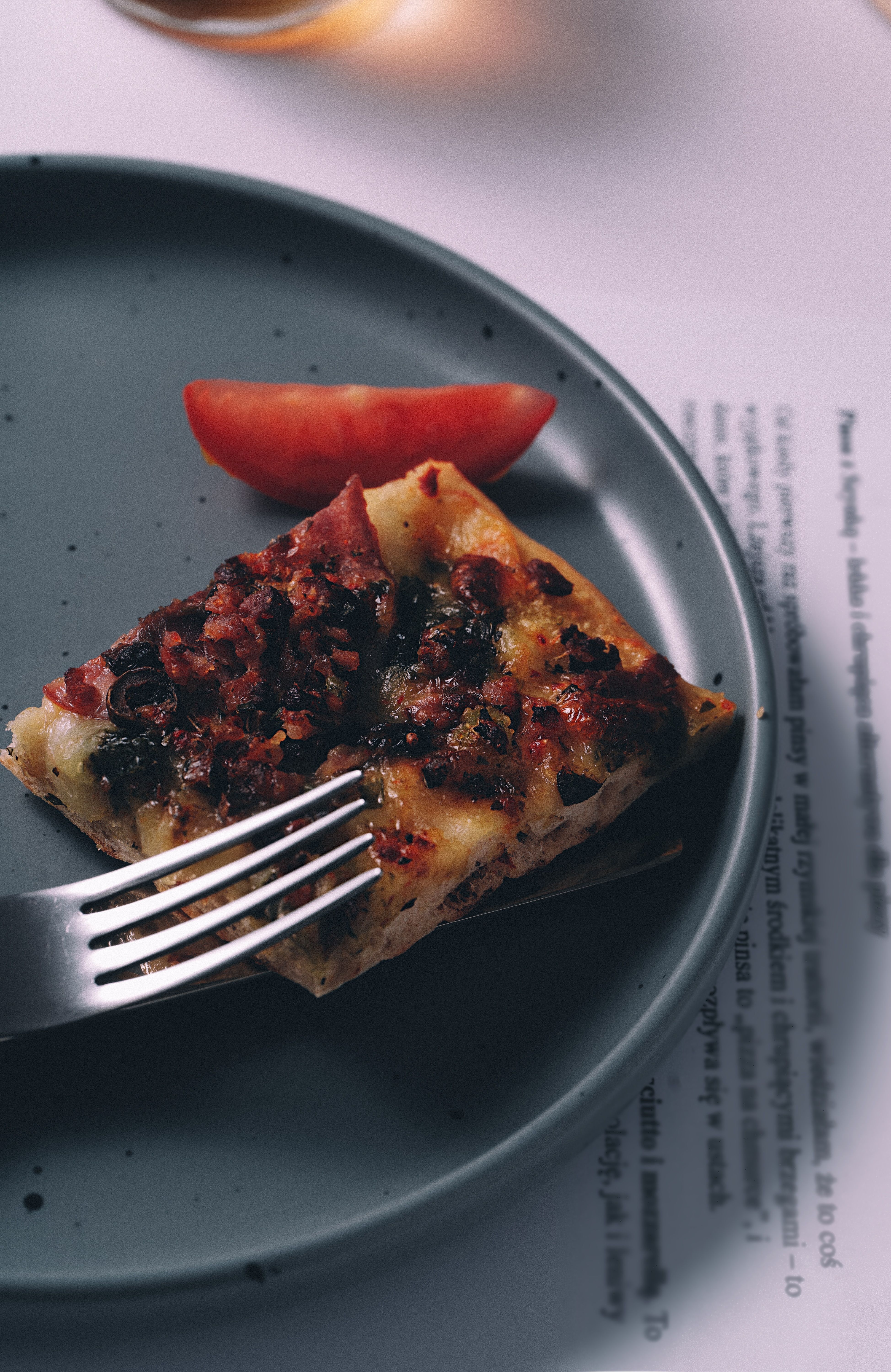 Gourmet Pizza Slice on Elegant Plate with Fork · Free Stock Photo