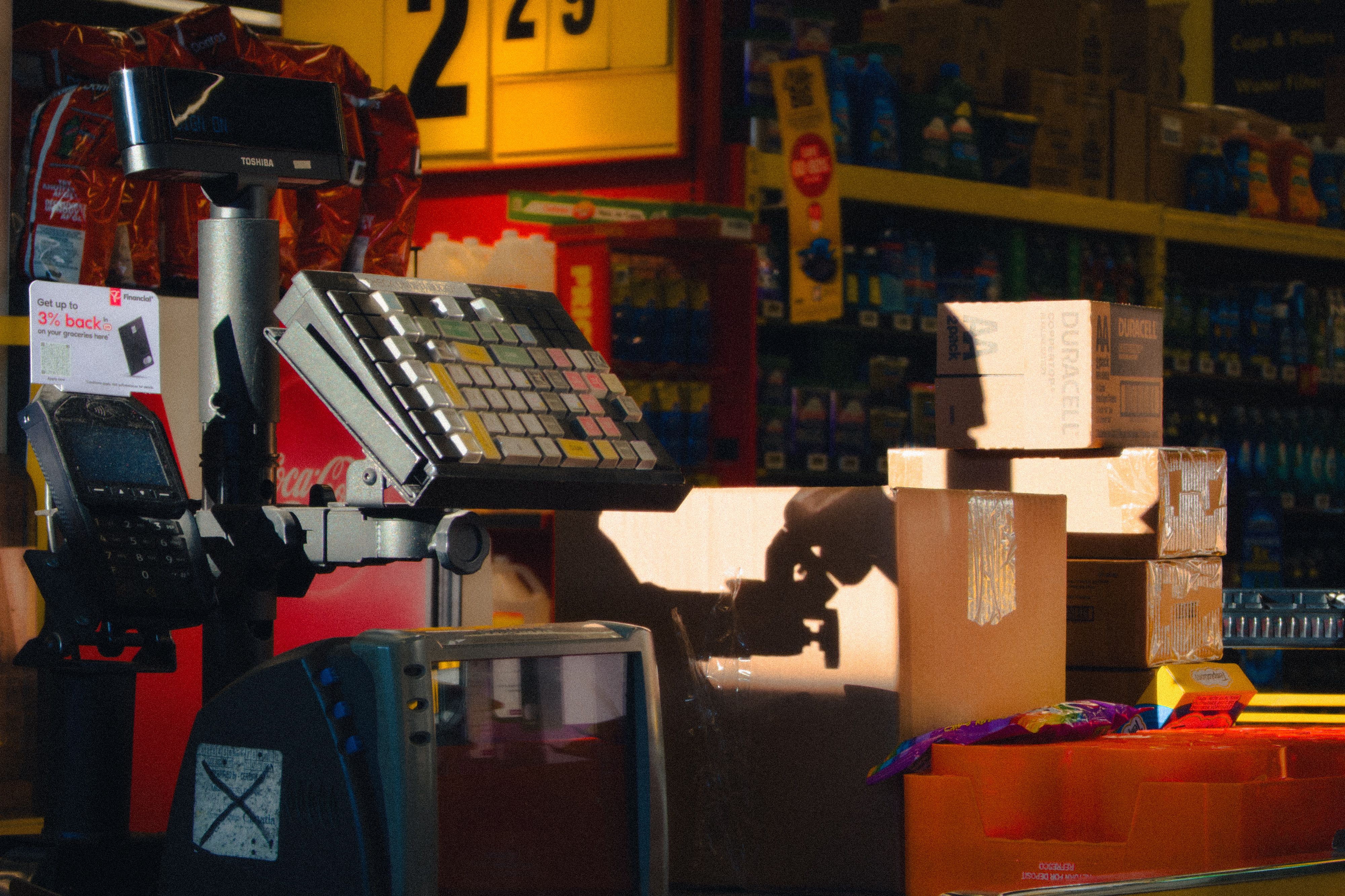 Cash Register and Boxes in a Retail Store · Free Stock Photo