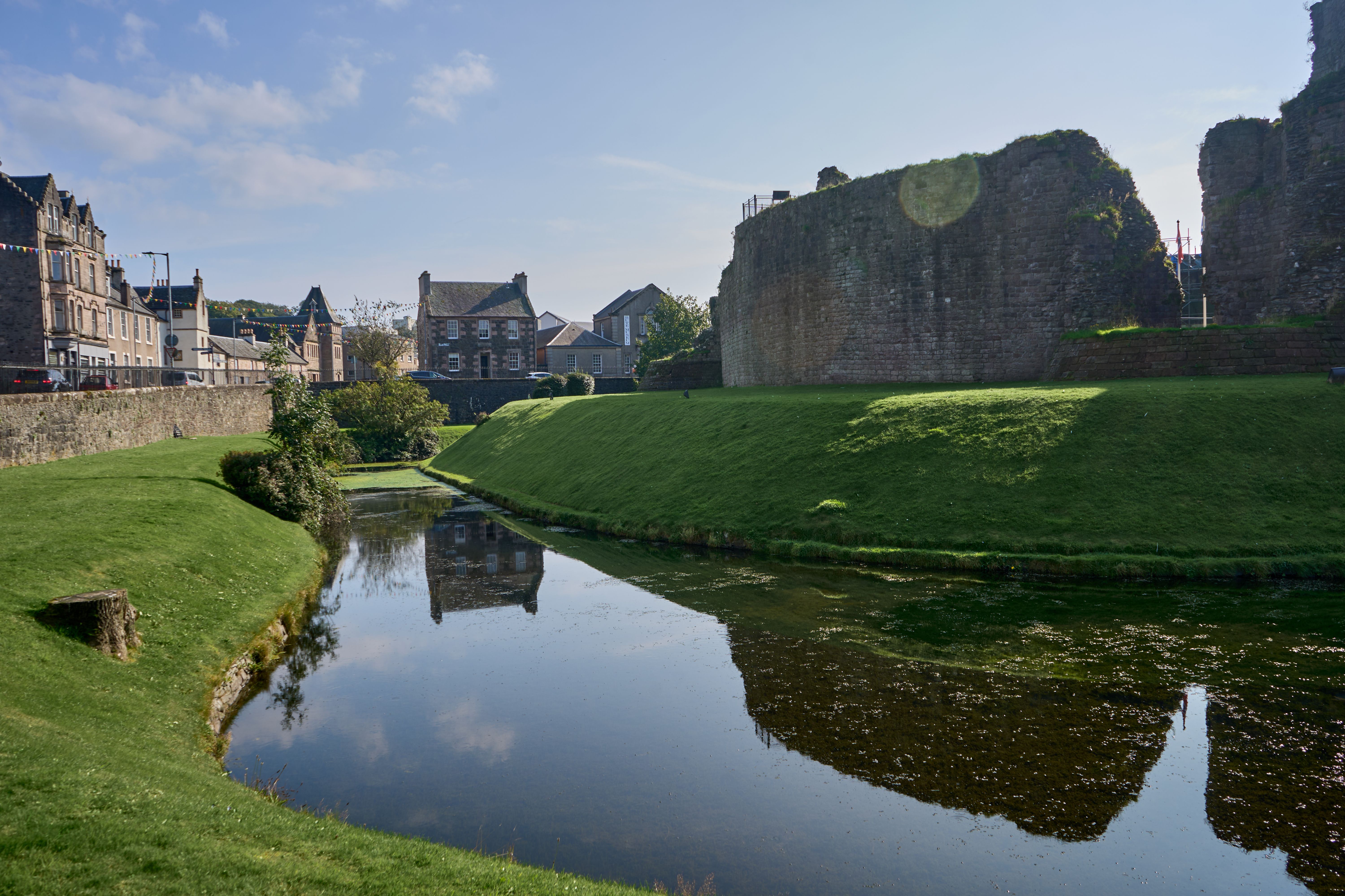 Medieval Rothesay Castle with Reflective Moat · Free Stock Photo