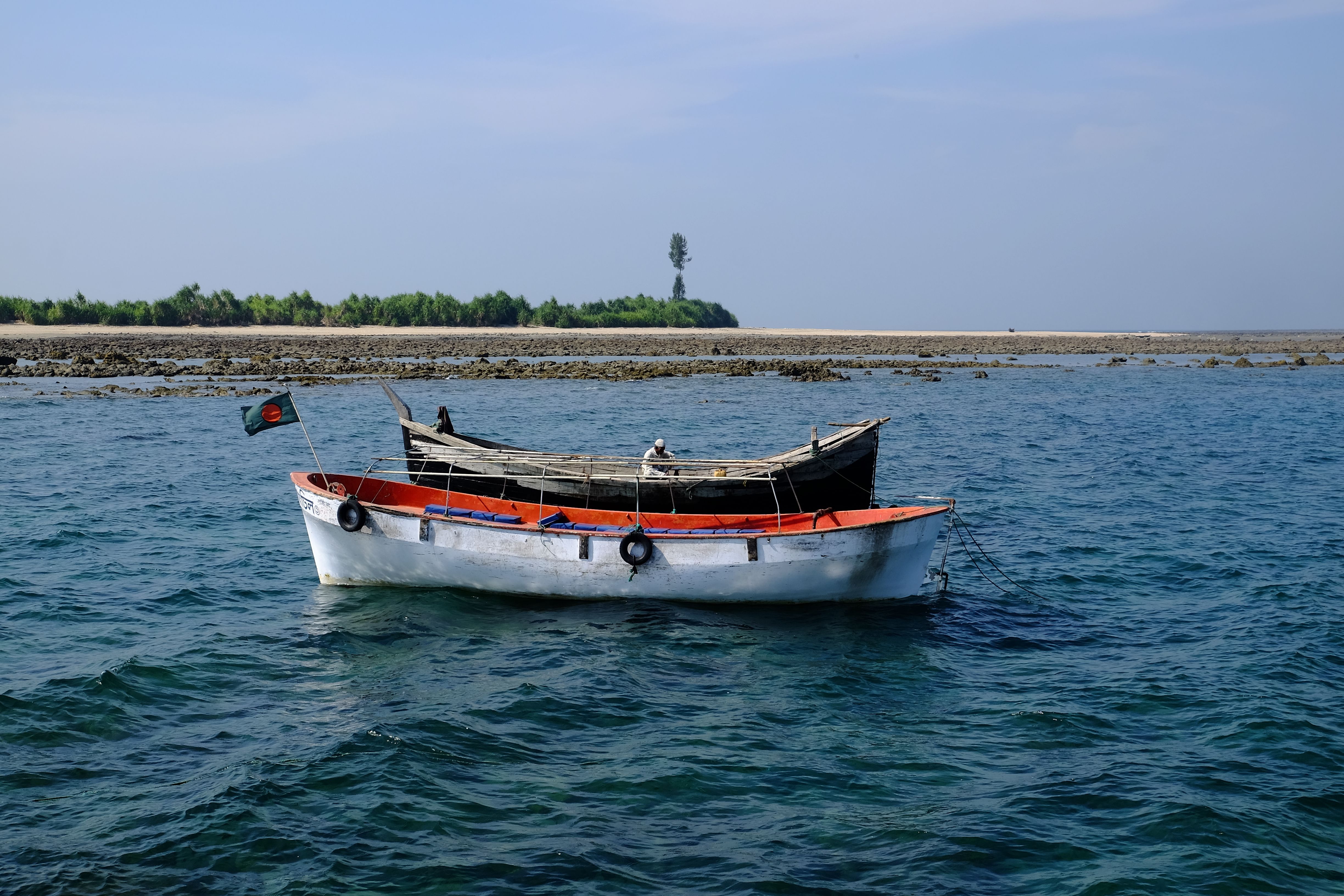 Fishing Boat Anchored Near Tropical Island · Free Stock Photo